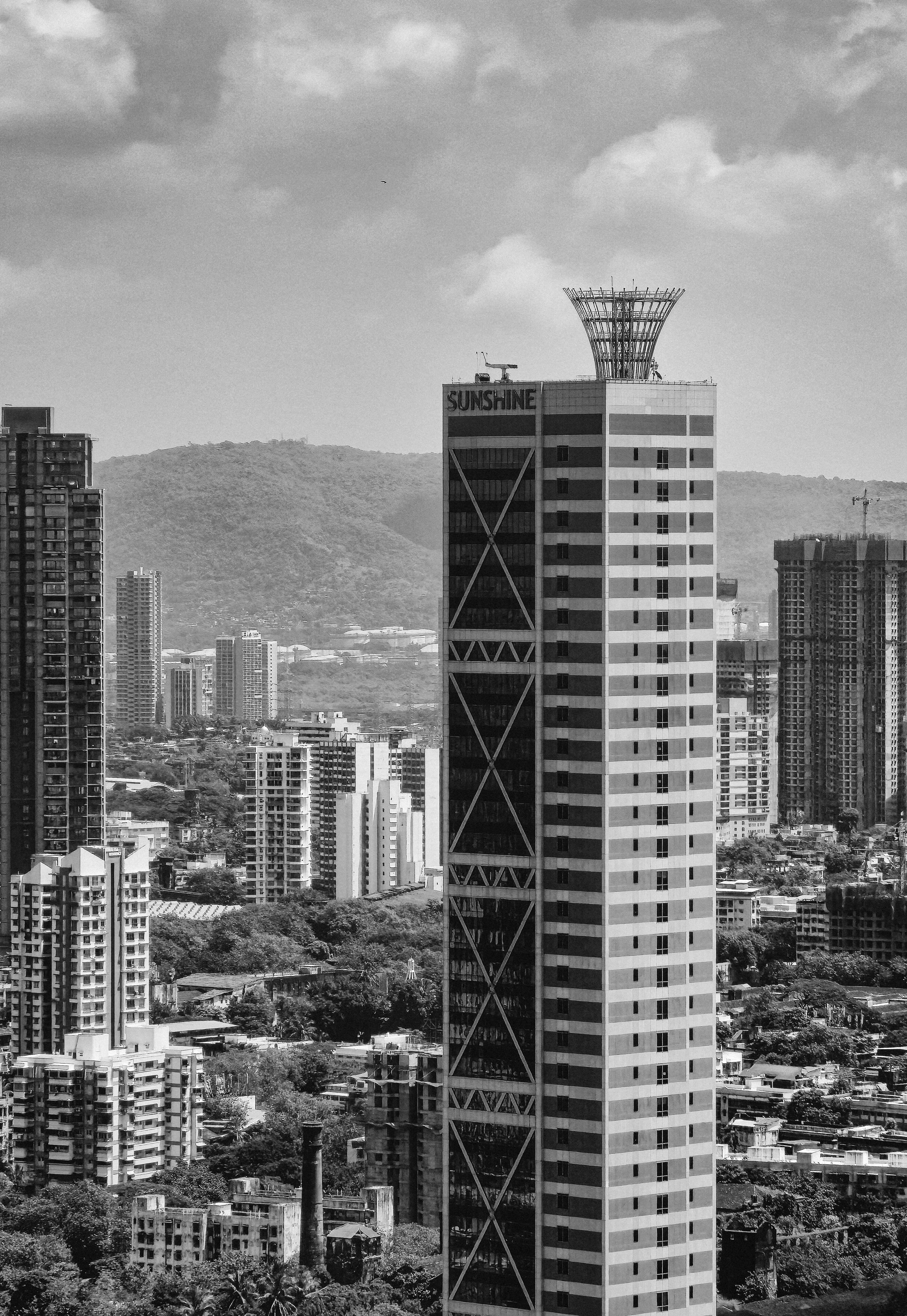Vertical Skyline: Sunshade Tower Rising Above a Sea of Buildings