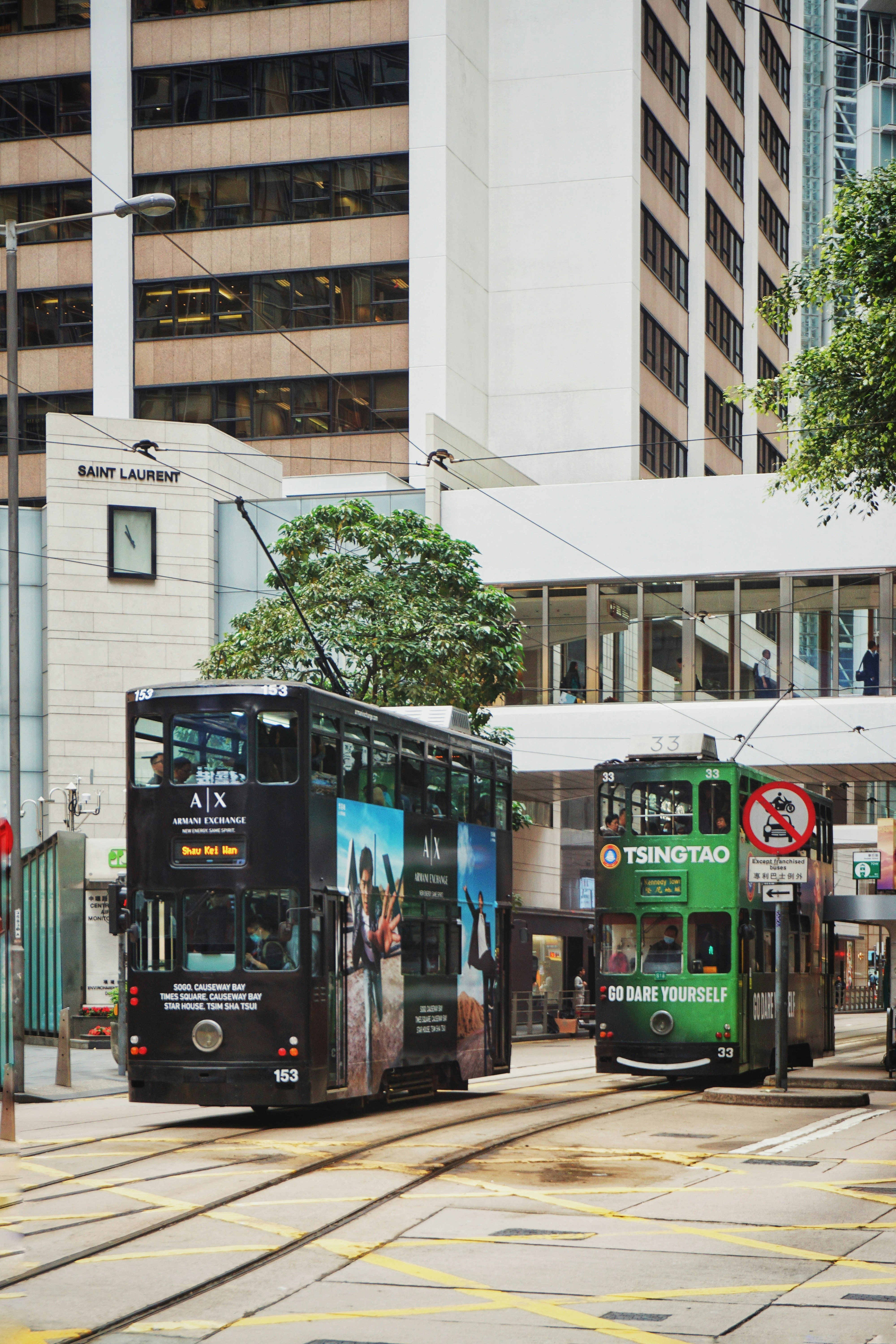 City Trams Converge: A Street-Level Dance Under Office Towers