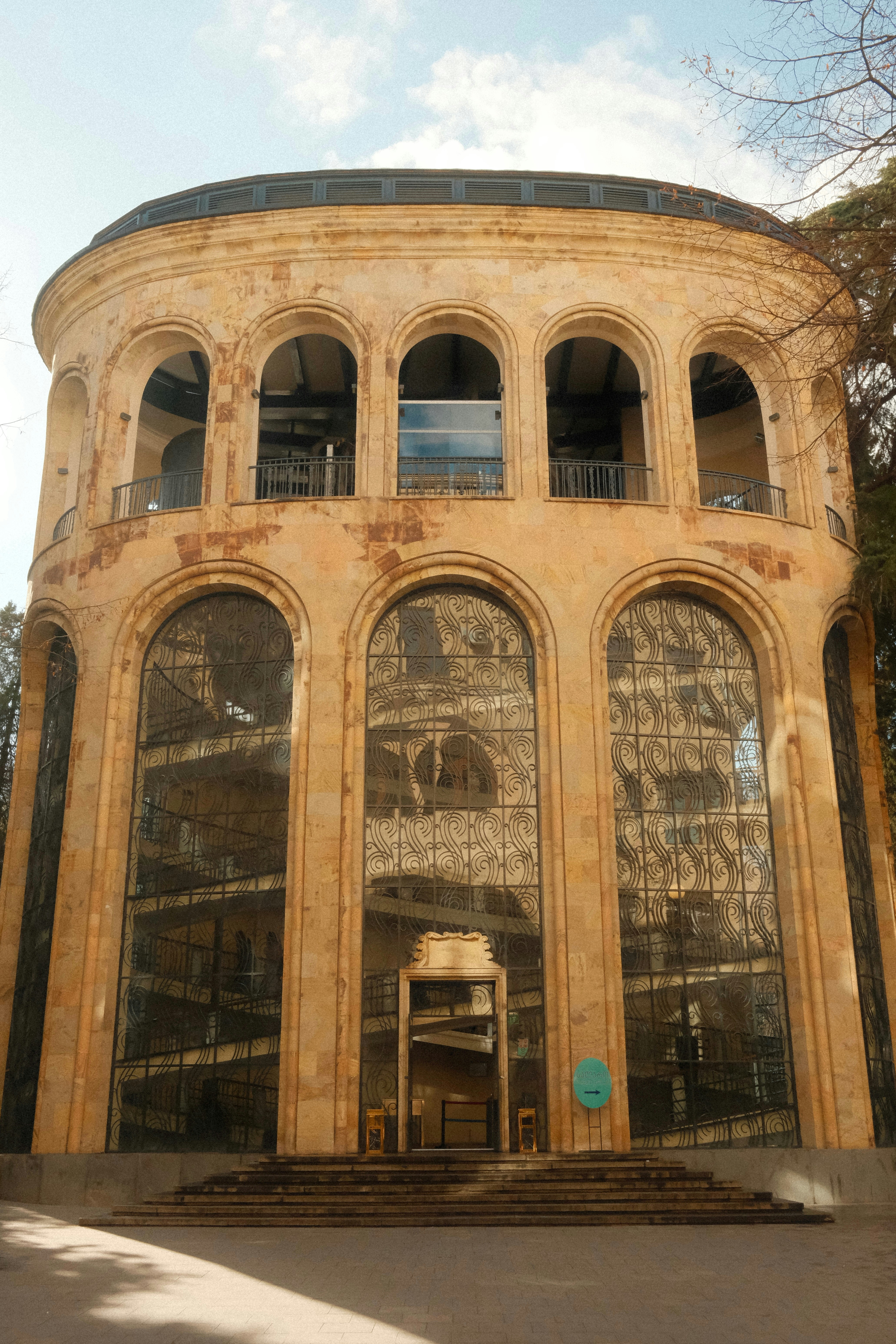 Sunlit Arcade: A Historic Facade Reborn in Warm Stone