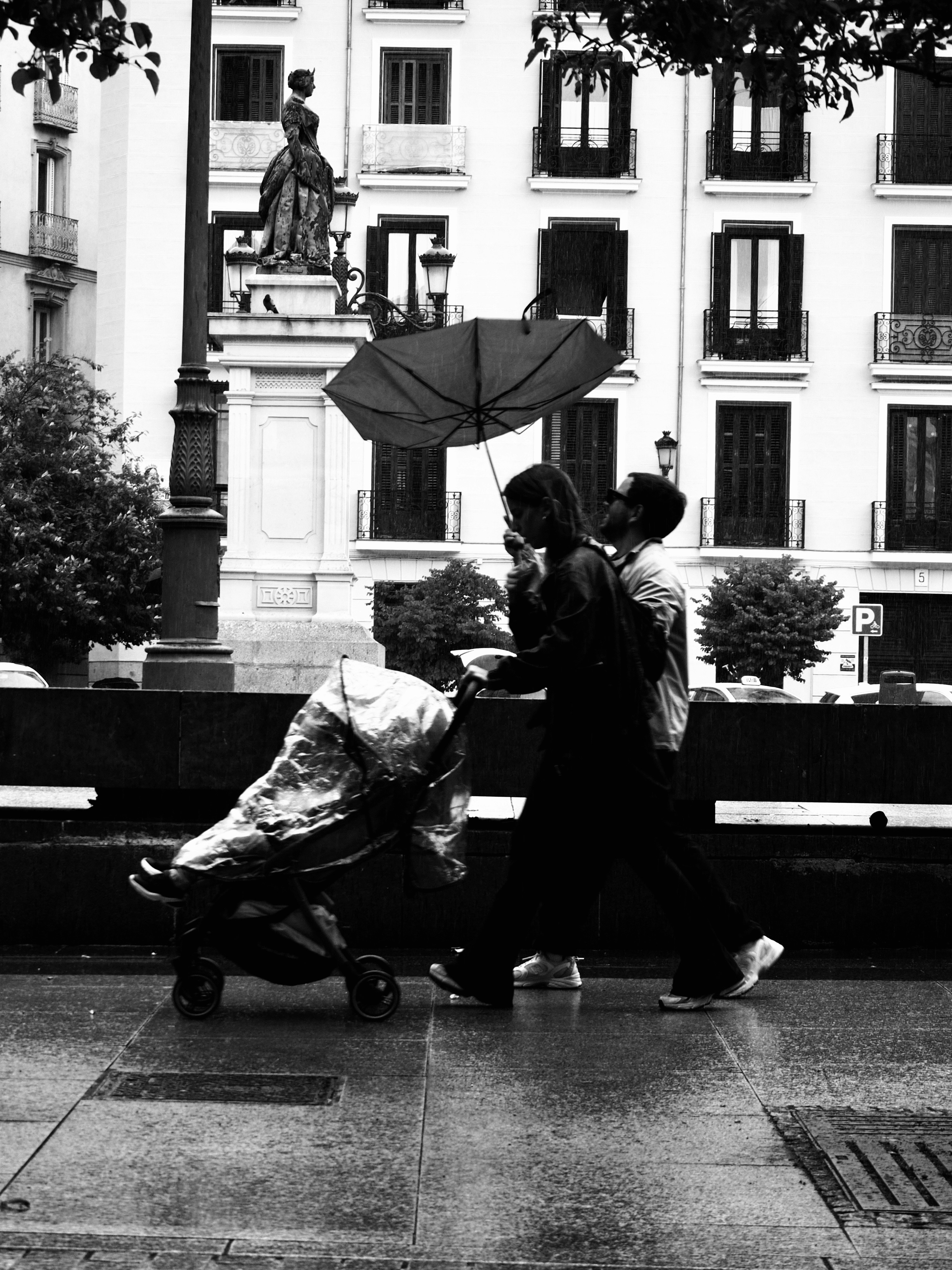 Umbrella in Motion: City Walk with a Glimpse of Rain