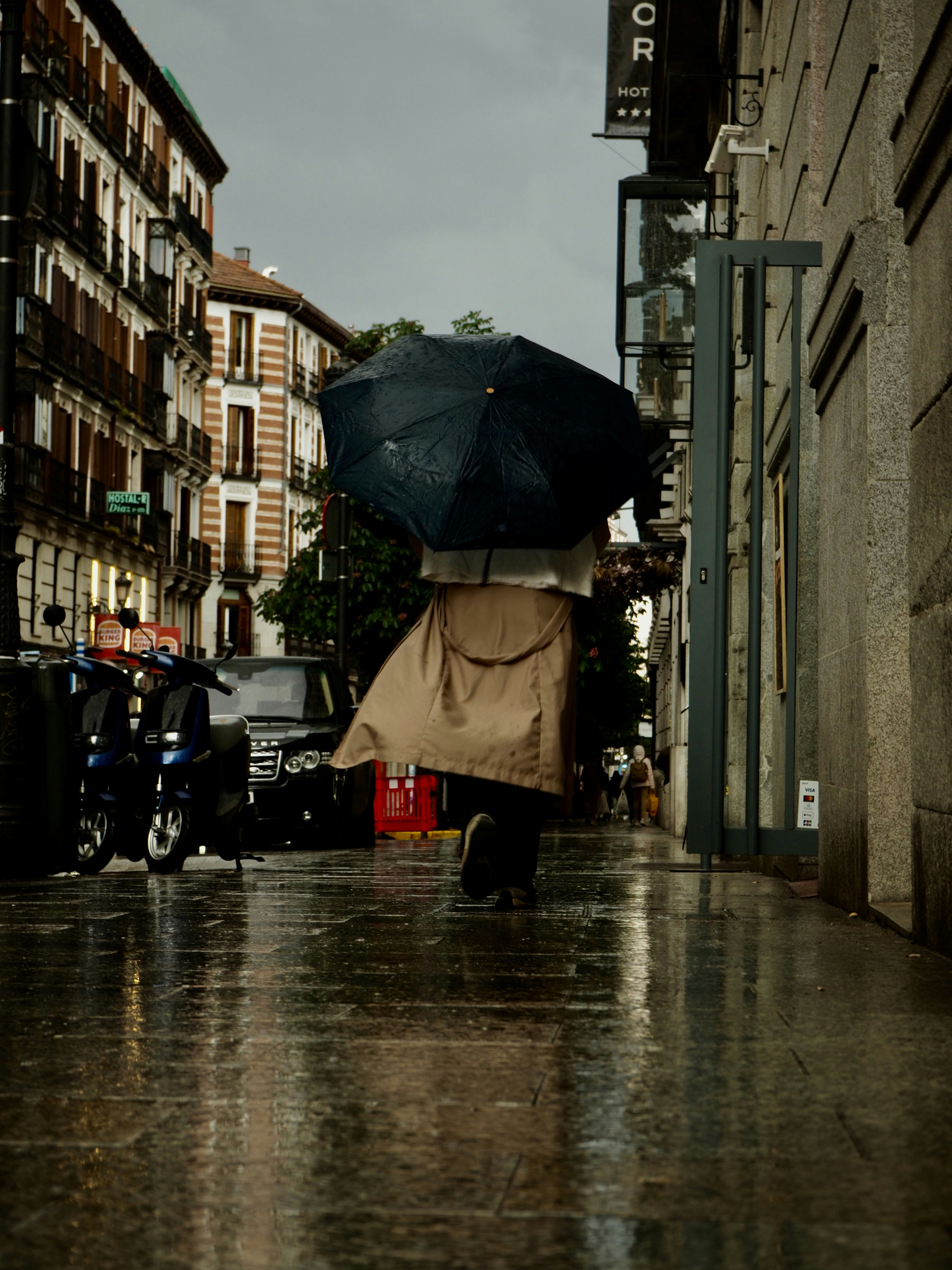 Umbrella and Trench in the Rain: A Quiet City Walk