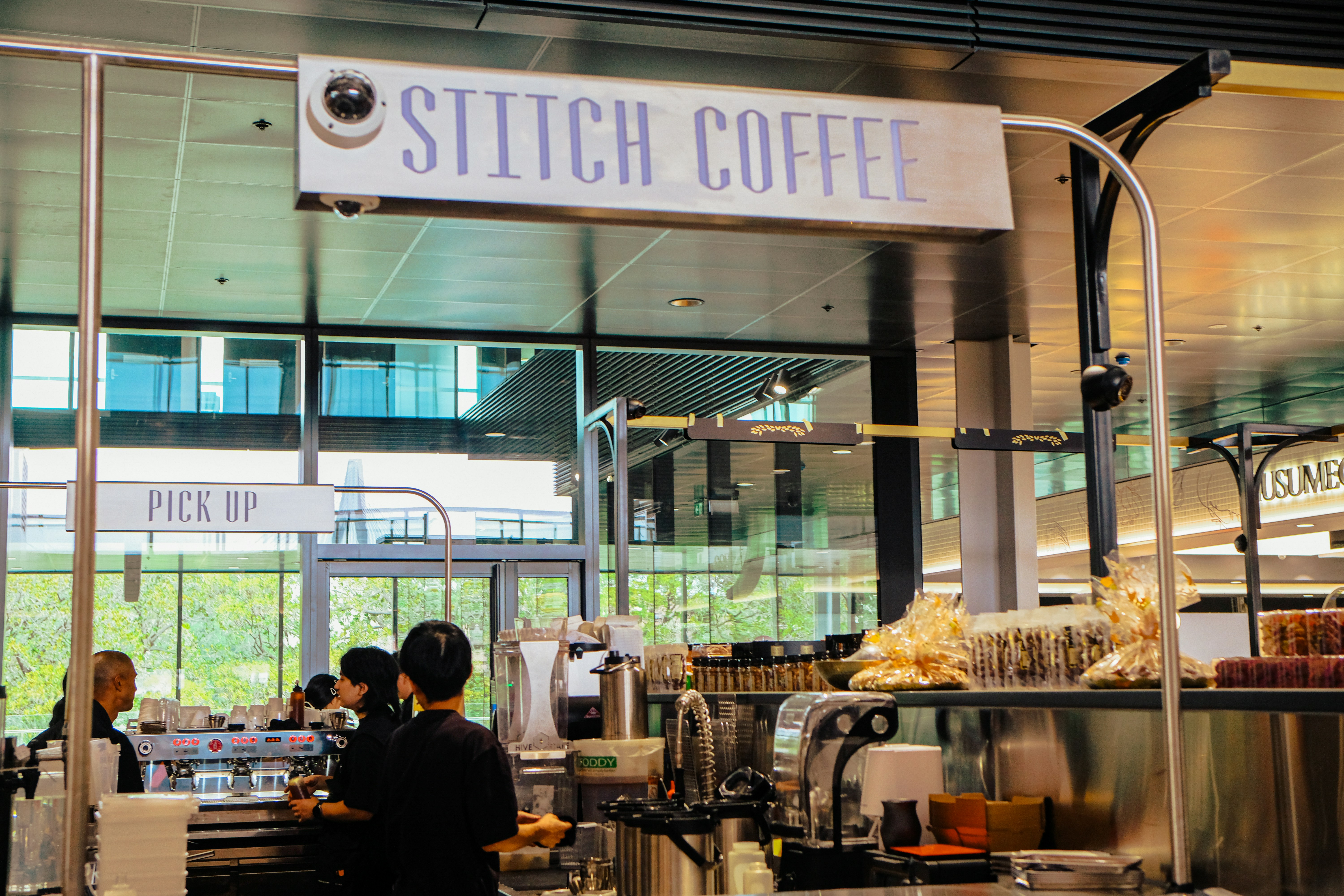 Streaks of daytime light over a modern coffee bar