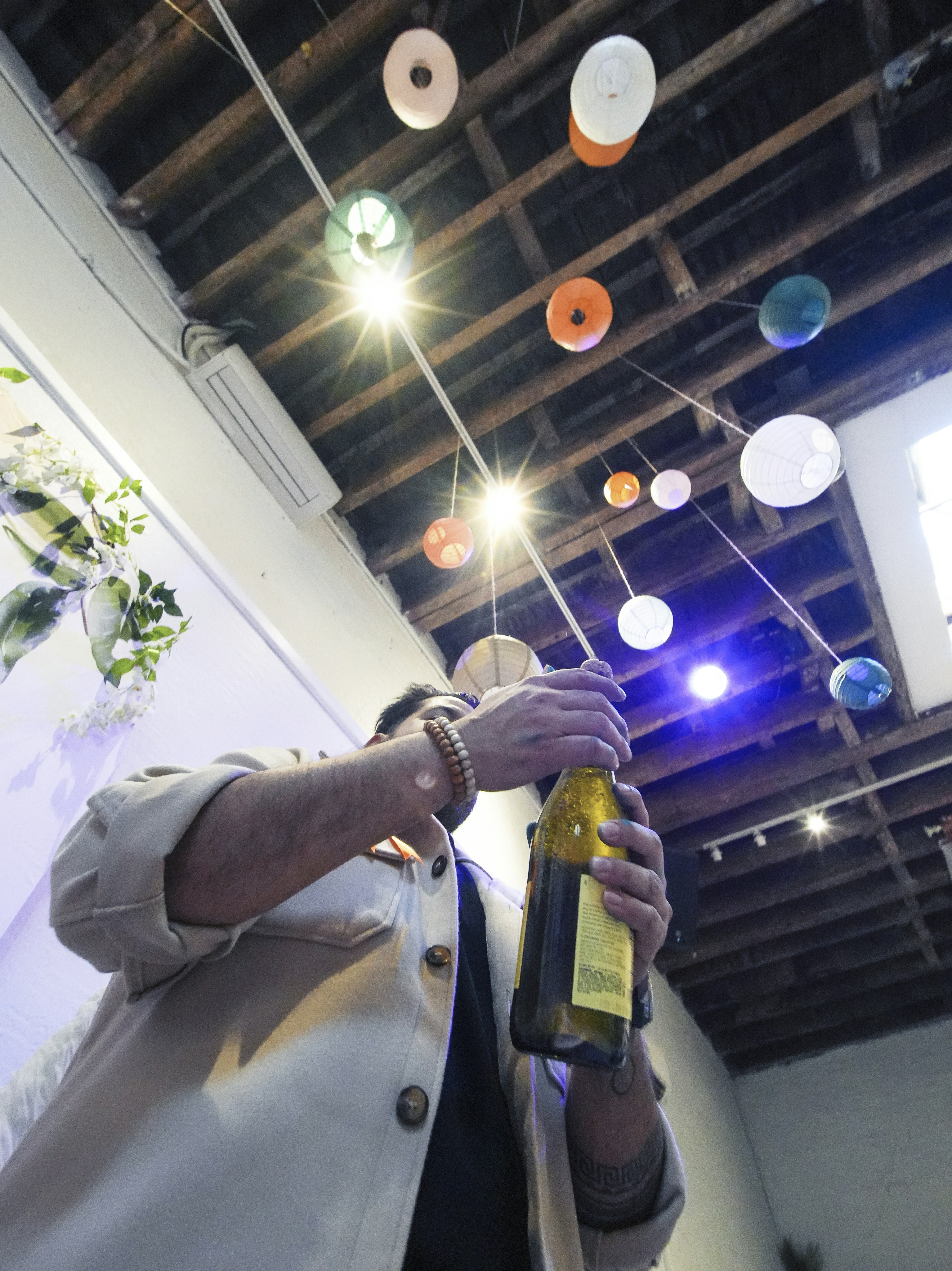Bottle Parade: A Low-Angle Celebration Under Colorful Orbs