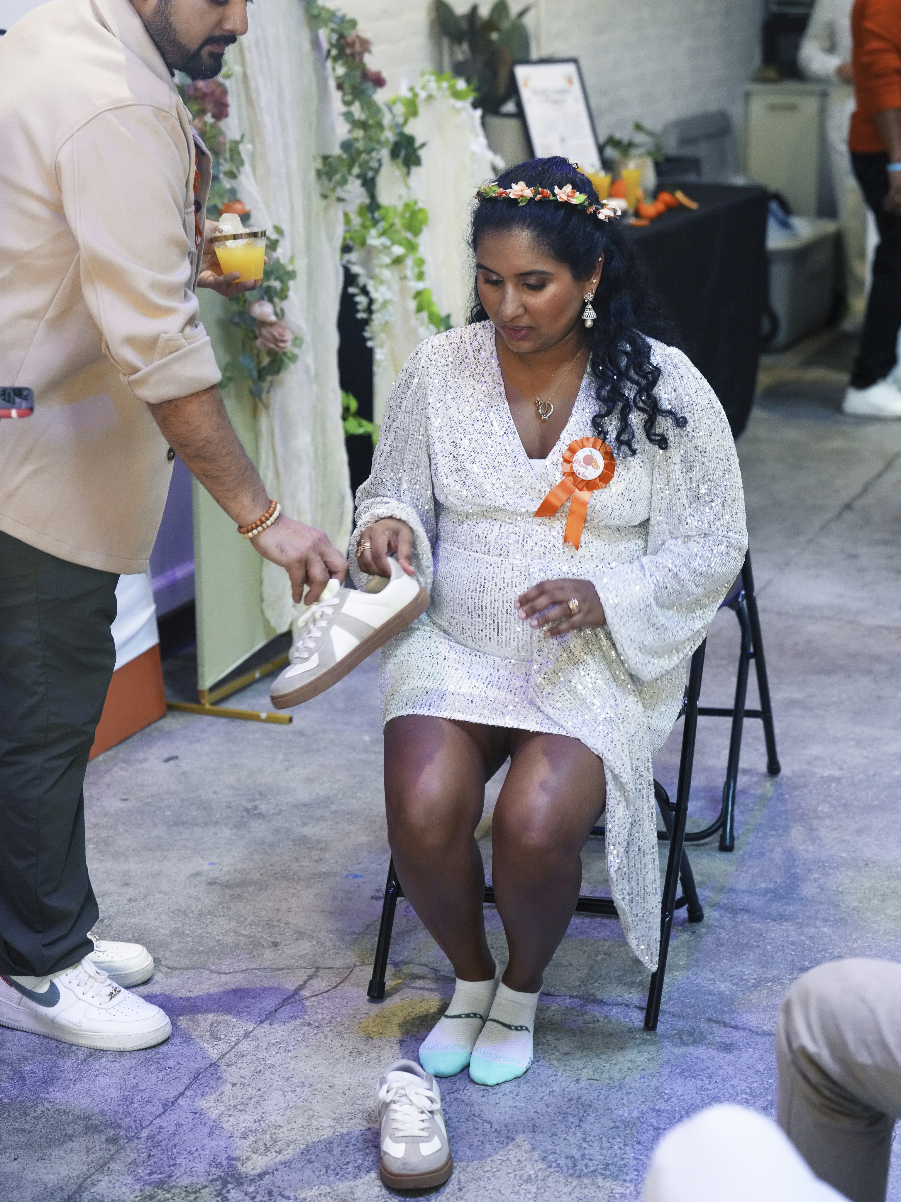 The Quiet Moment: Bride in White Receiving a Shoe Tradition