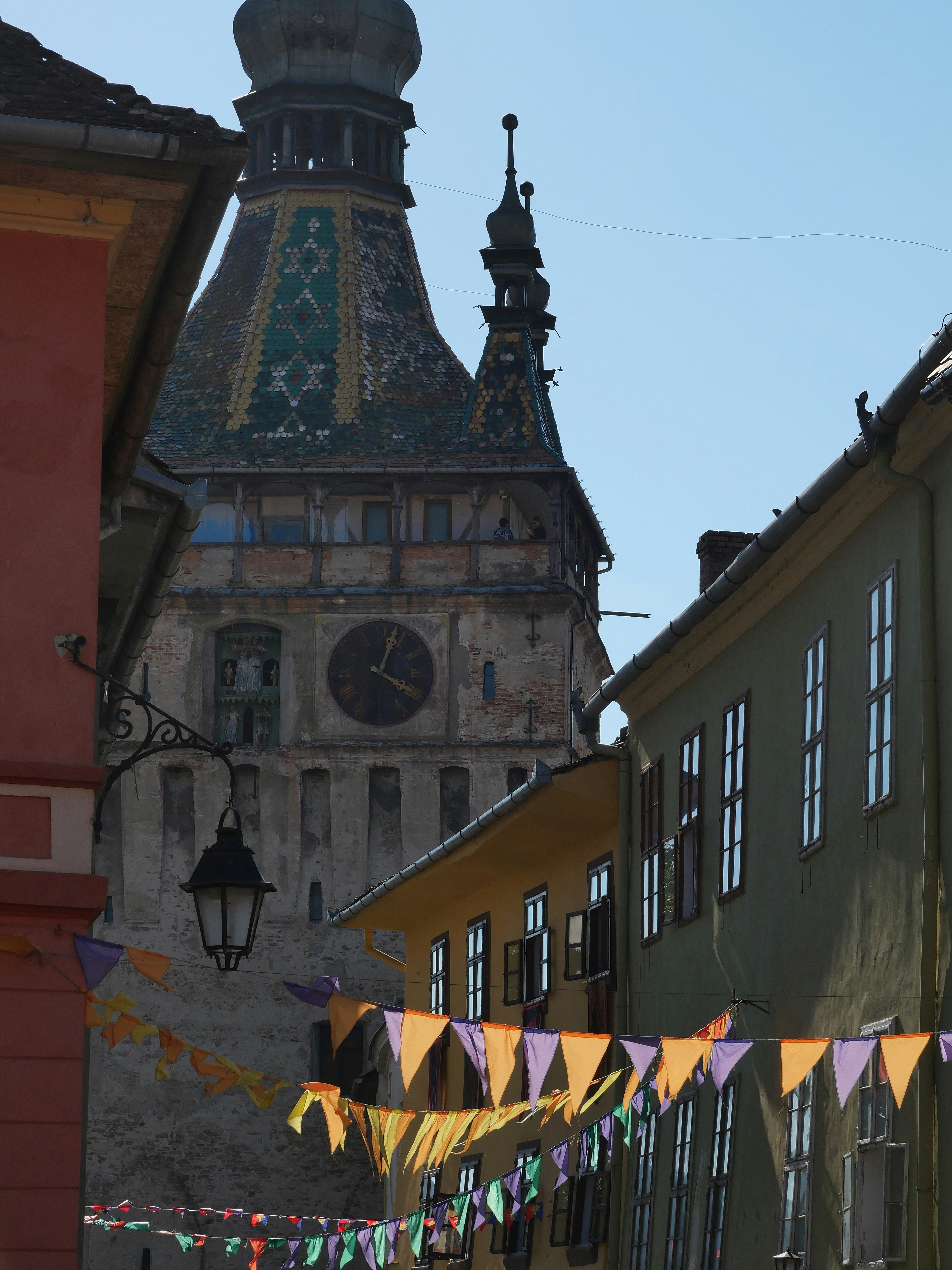 Clocked Crown: A Turret, Tiles, and Triangles in a Narrow Street