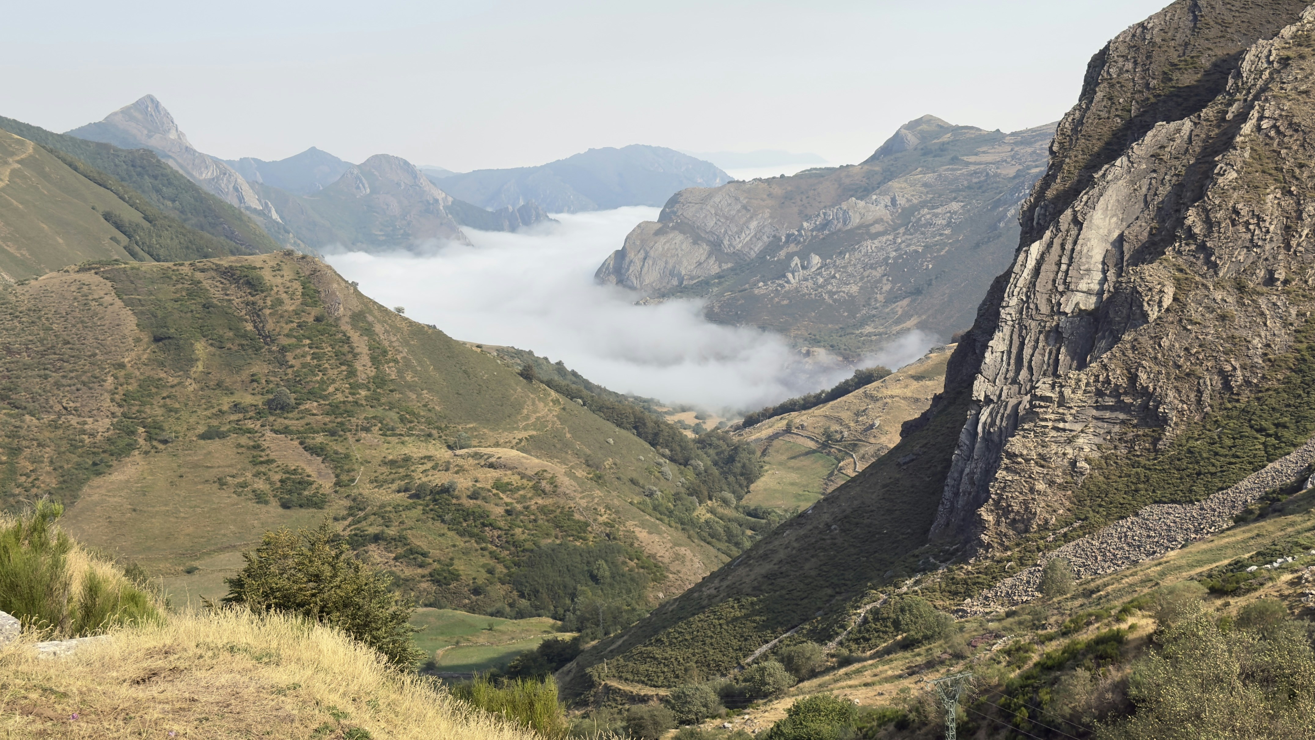Valley Mist Embrace: A Mountain Fold Beyond the Ridge