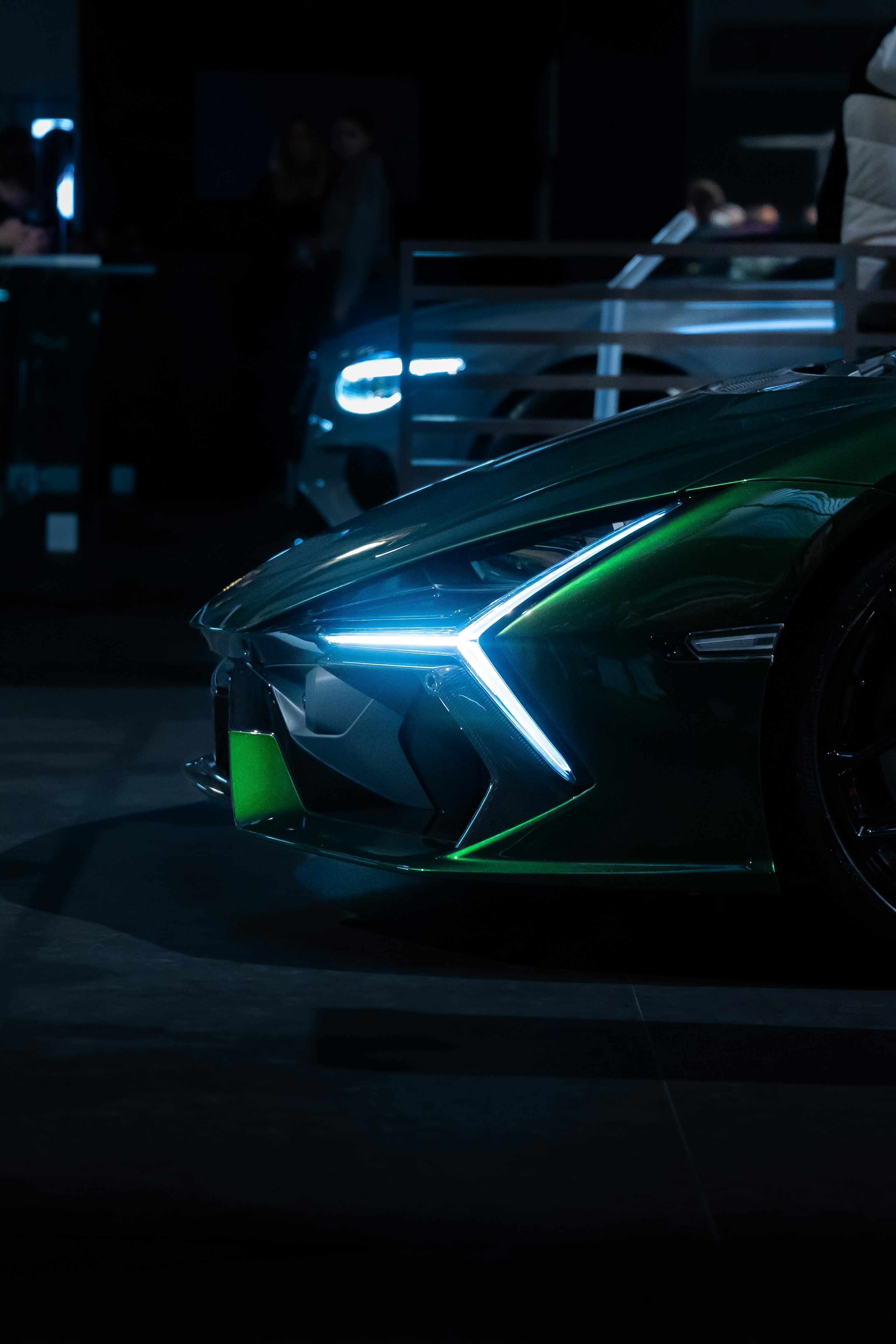 Green sports car with illuminated headlights at night photo – Free Cars ...
