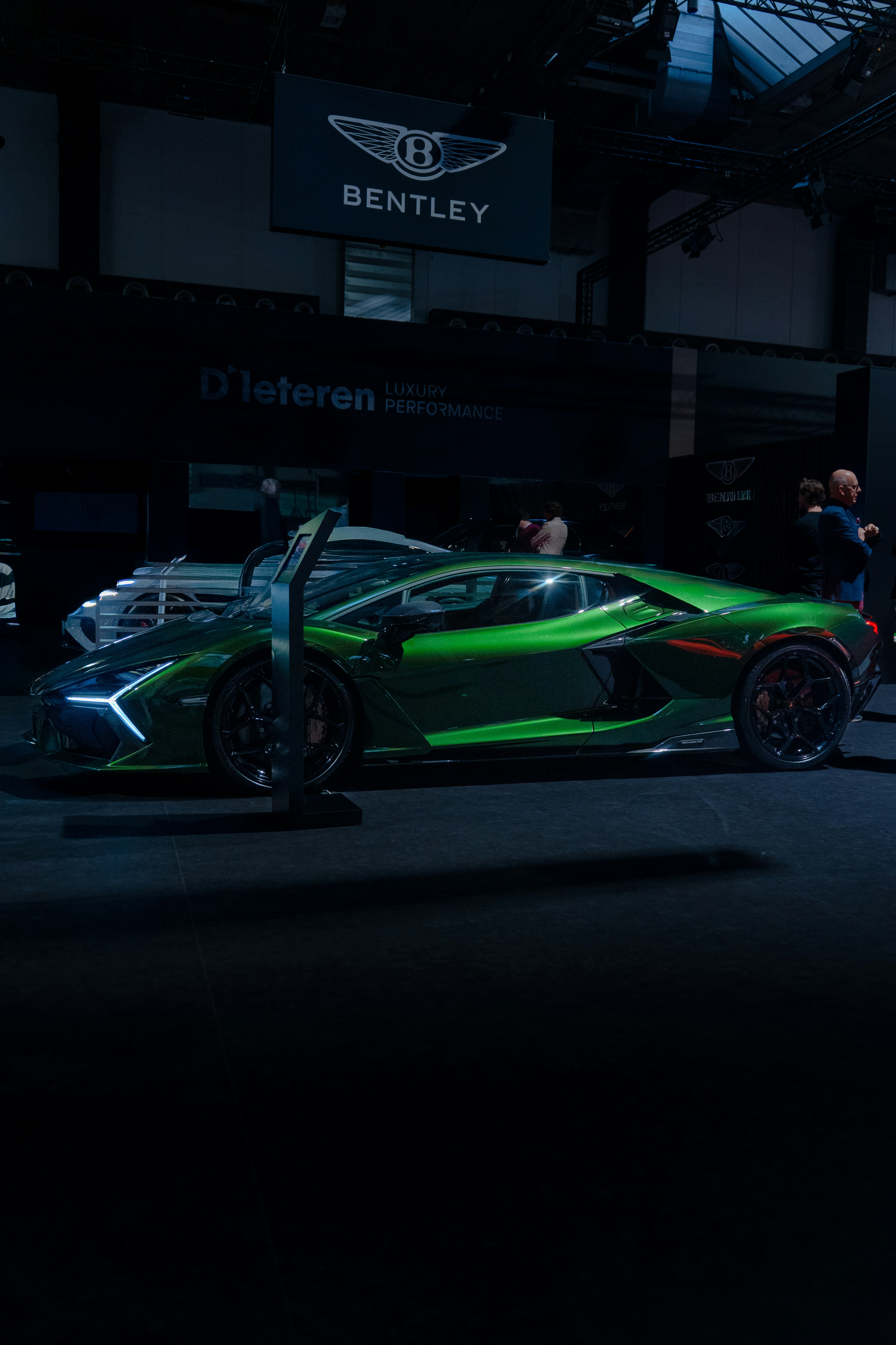 Emerald Velocity: A Green Supersport Emerges Under Neon Booths