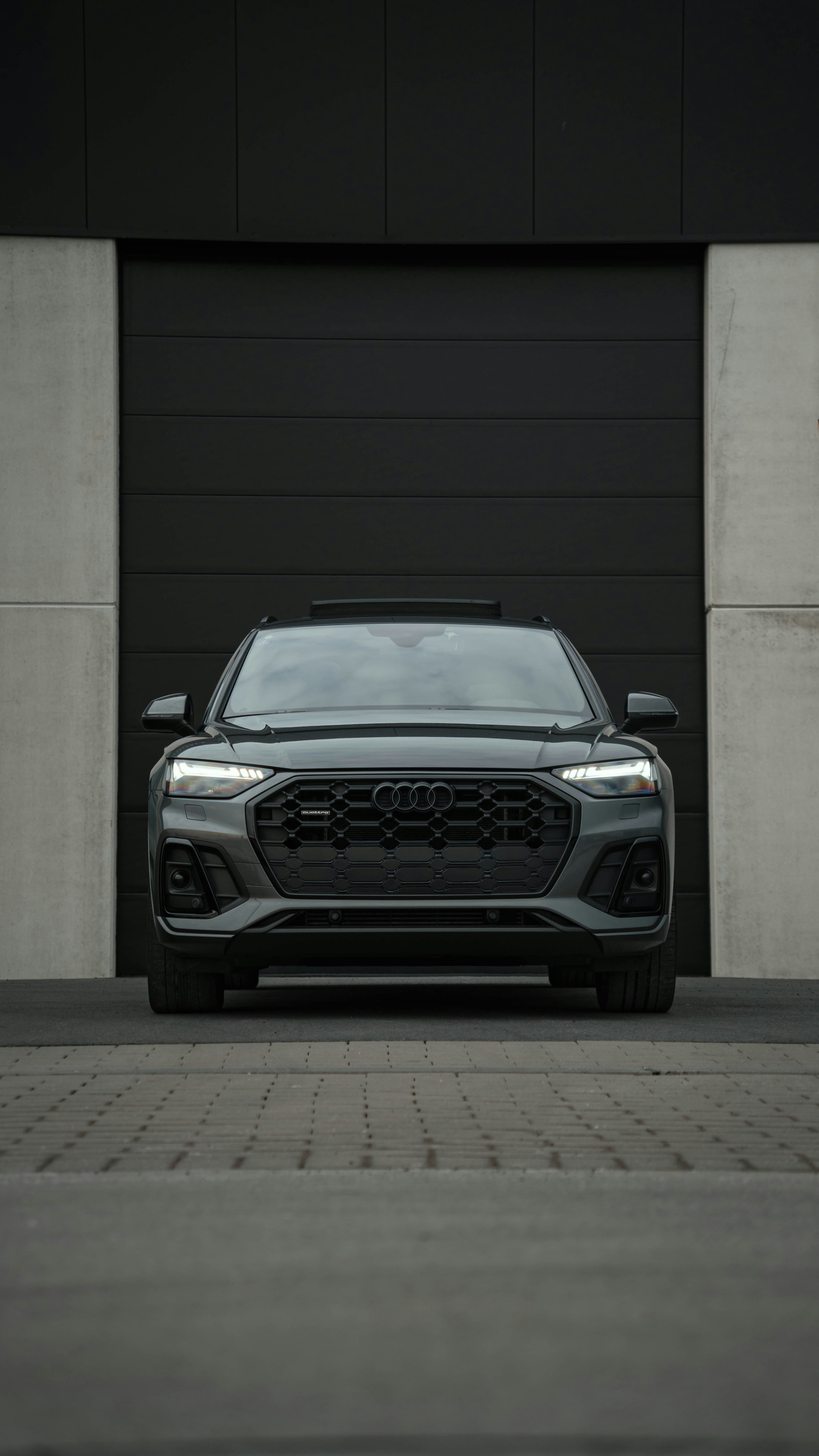 Midnight Predator: Front View of a Dark Audi SUV Ready for the Urban Beat