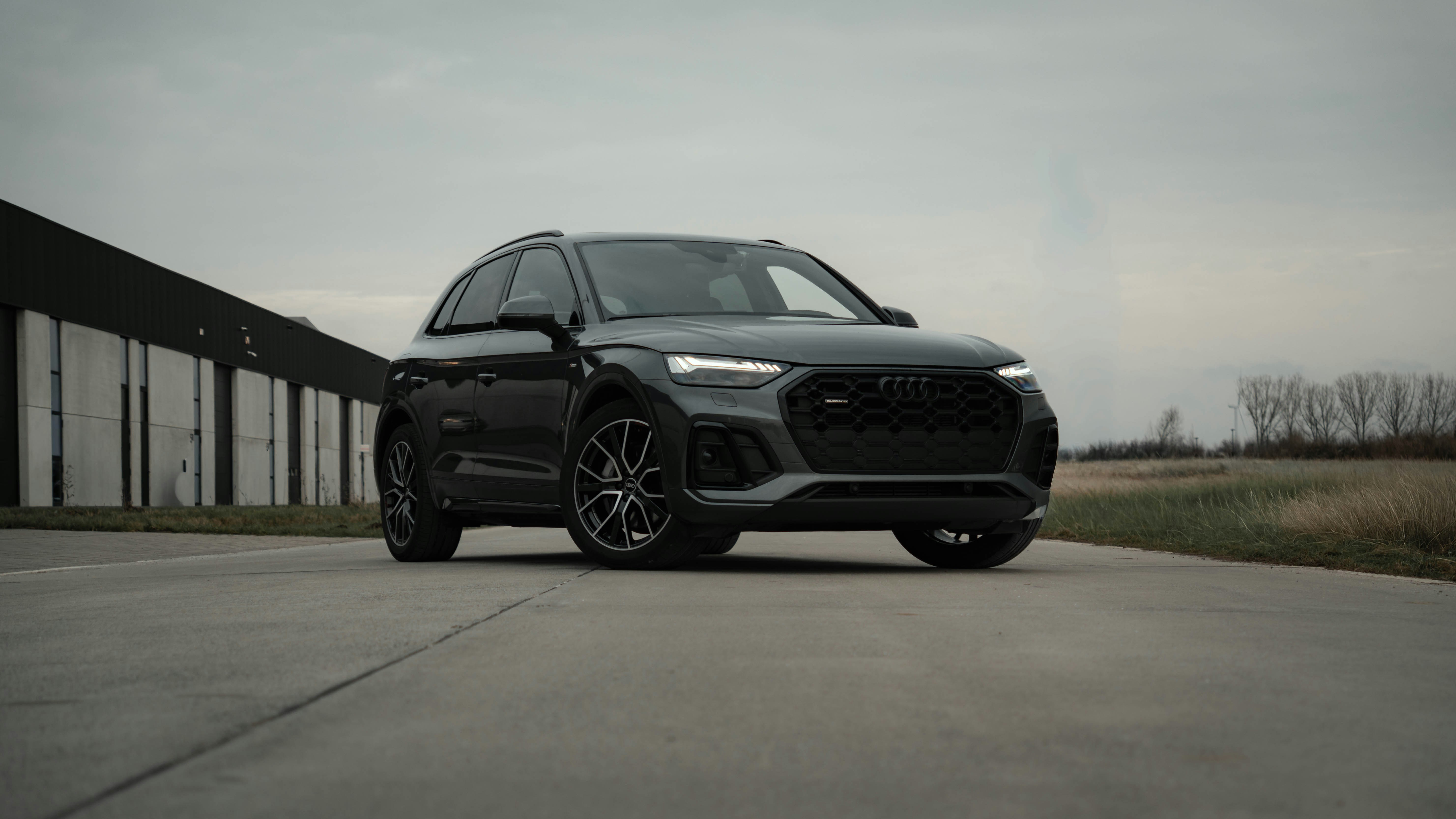 Shadowed Precision: Audi SUV in Quiet Industrial Light