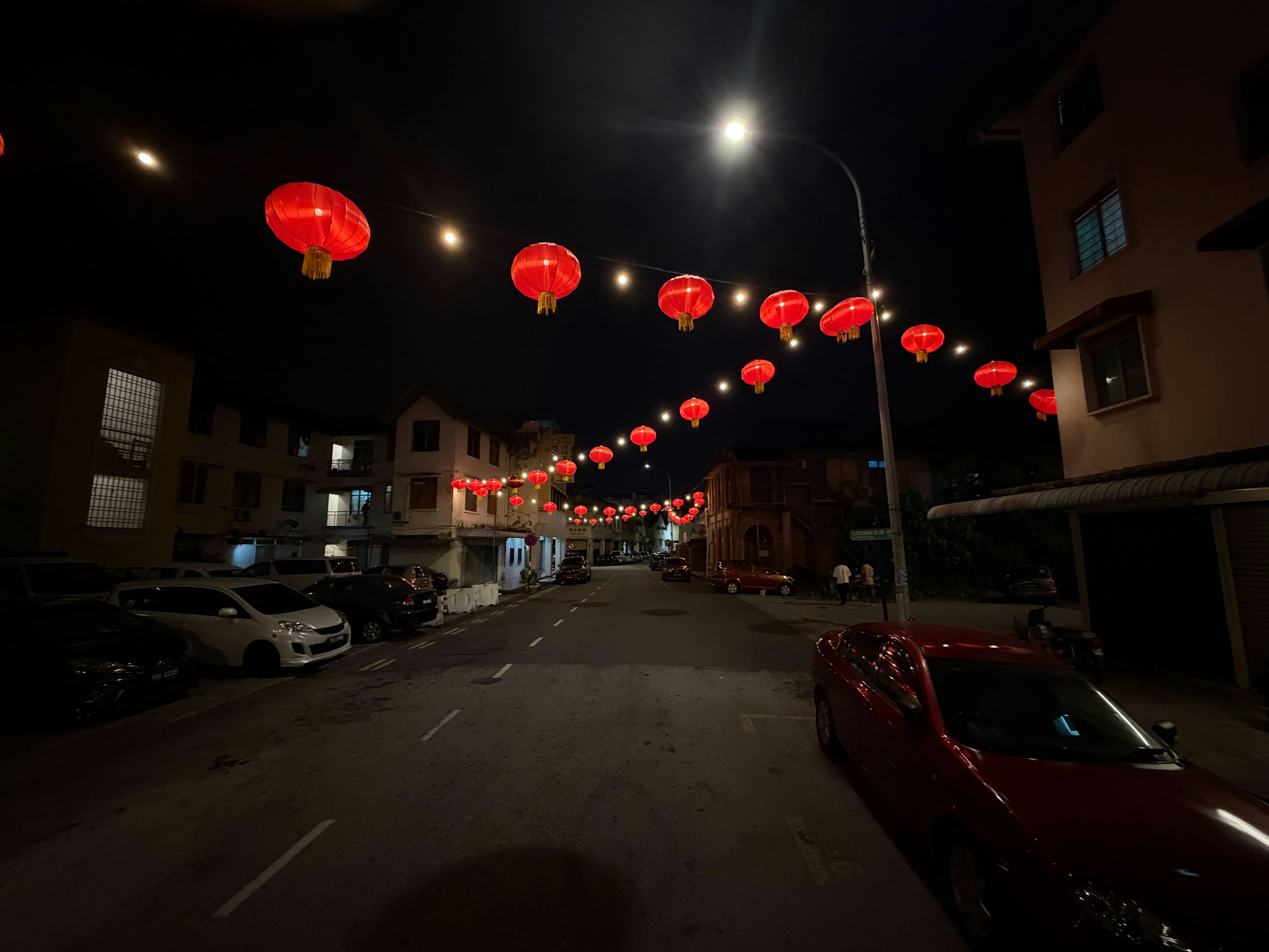 Lanterns Over a Quiet Street at Night