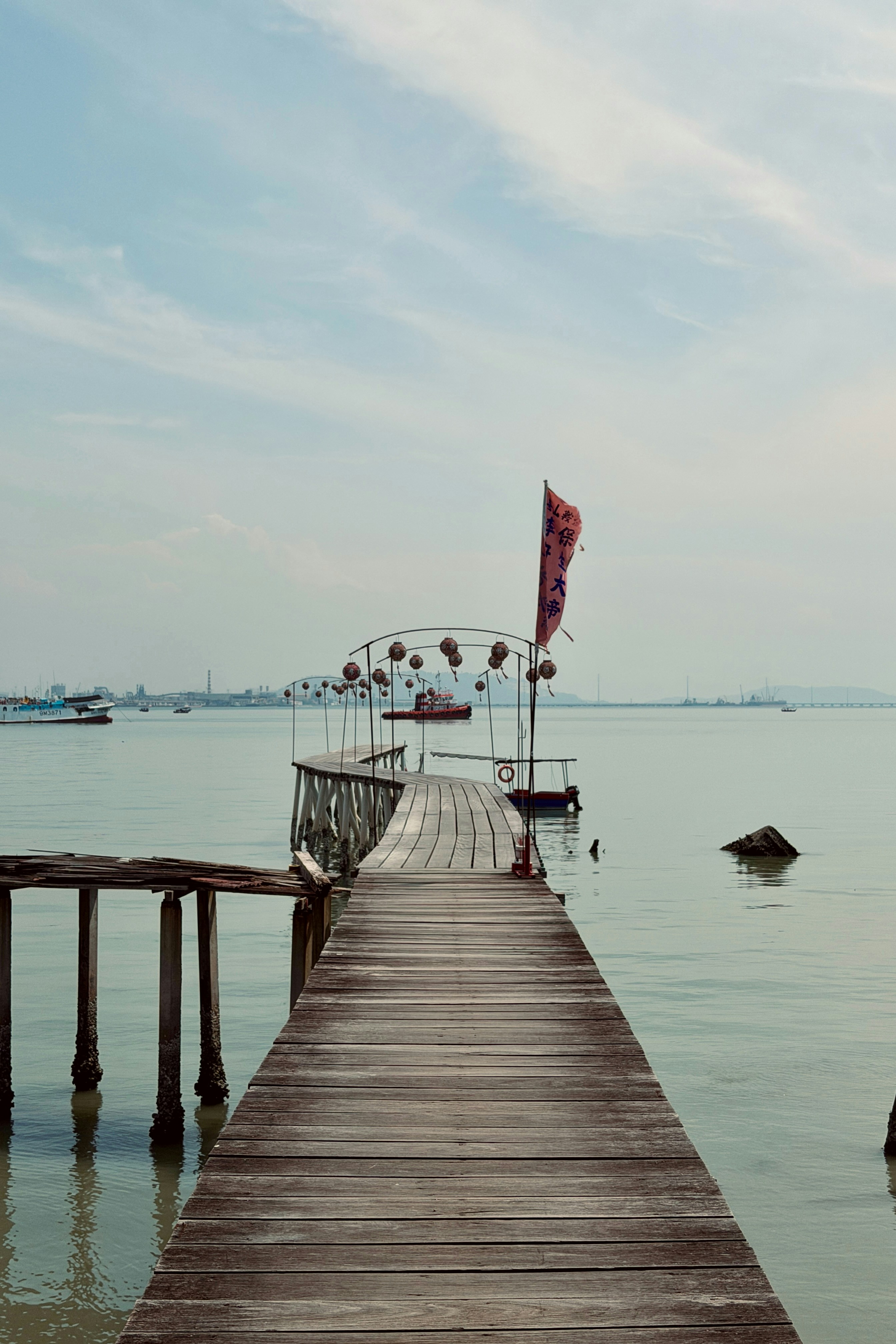 Lonely Pier Reaches Toward a Calm Estuary