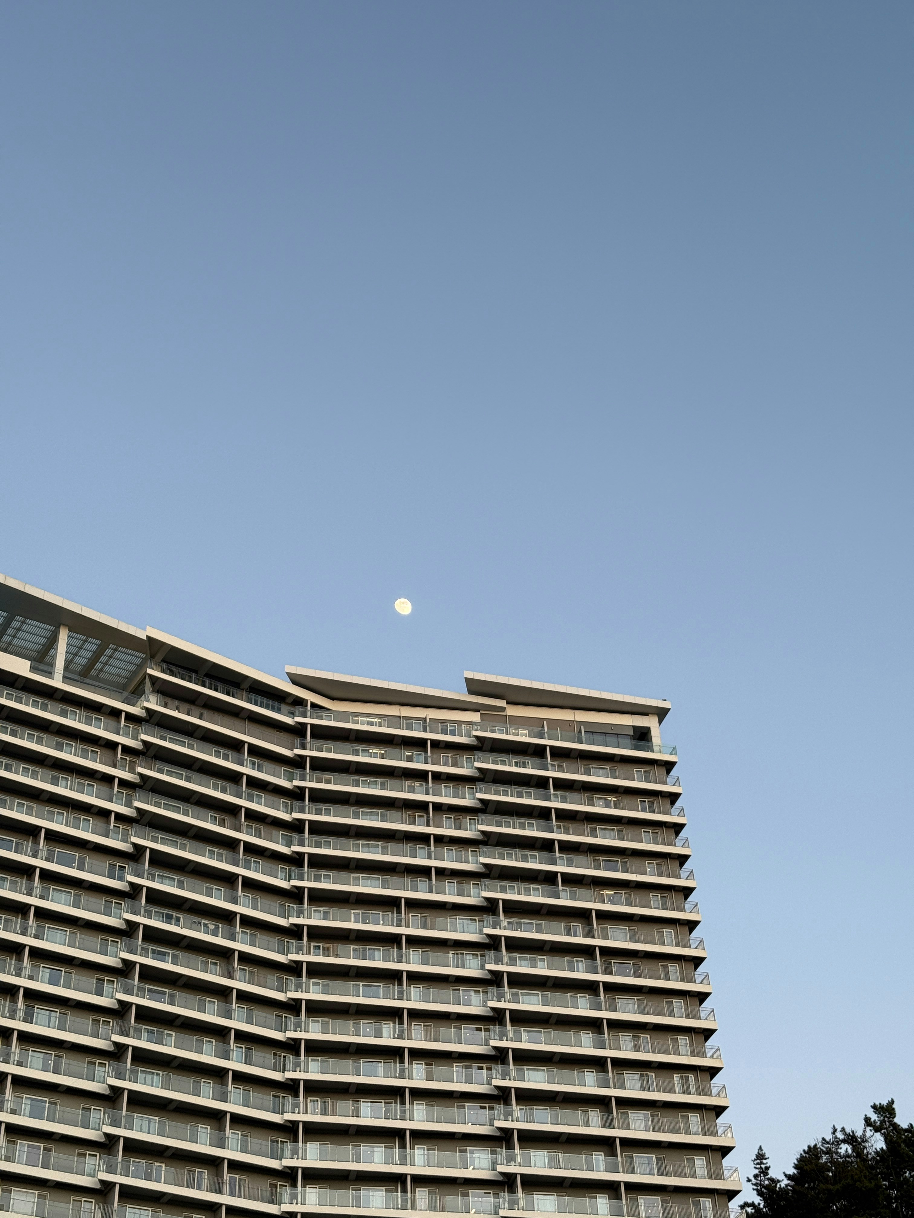 Moon Above the Distinctive Balcony Facade
