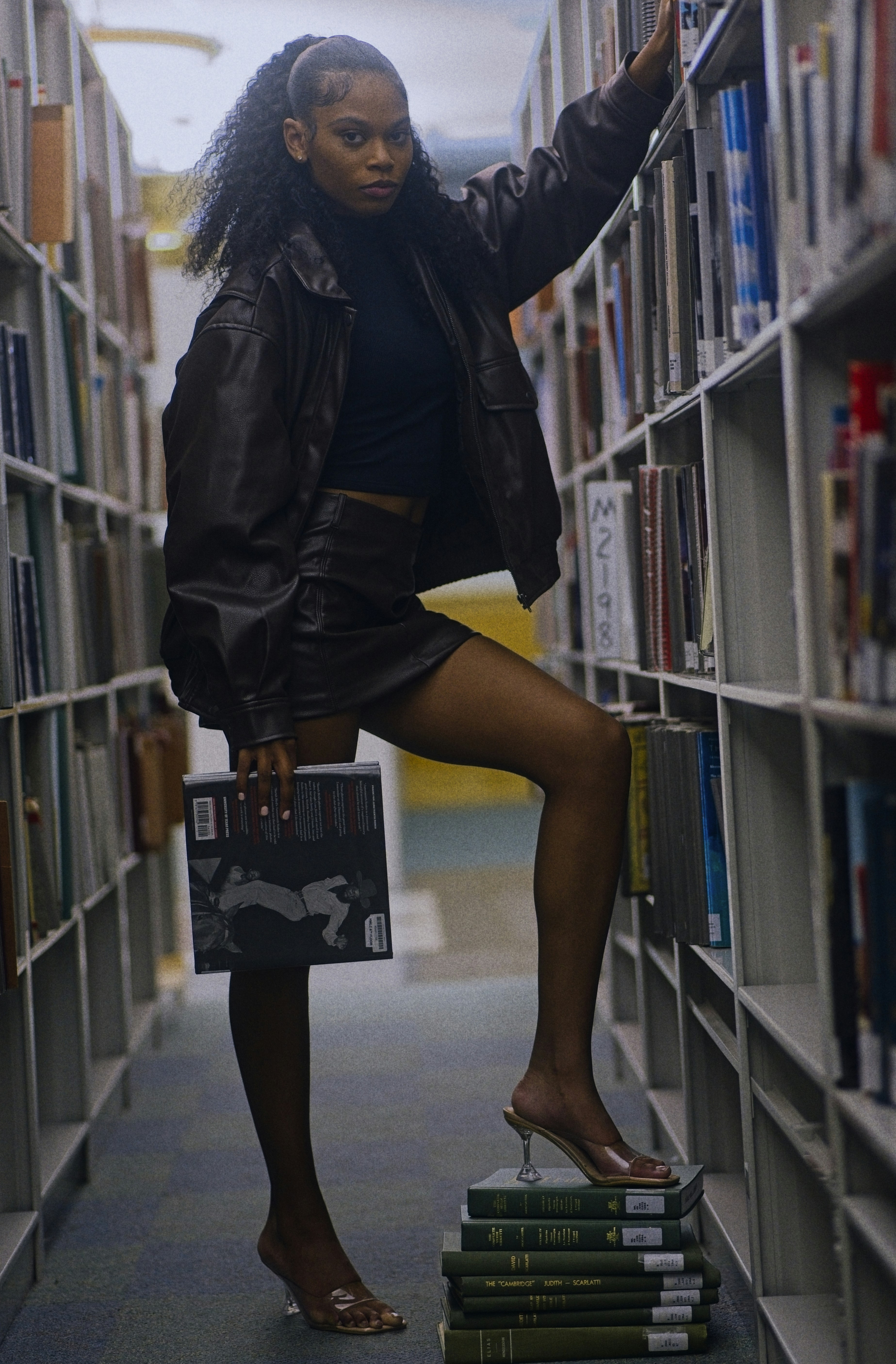 Stride of Confidence: A Library Aisle Portrait