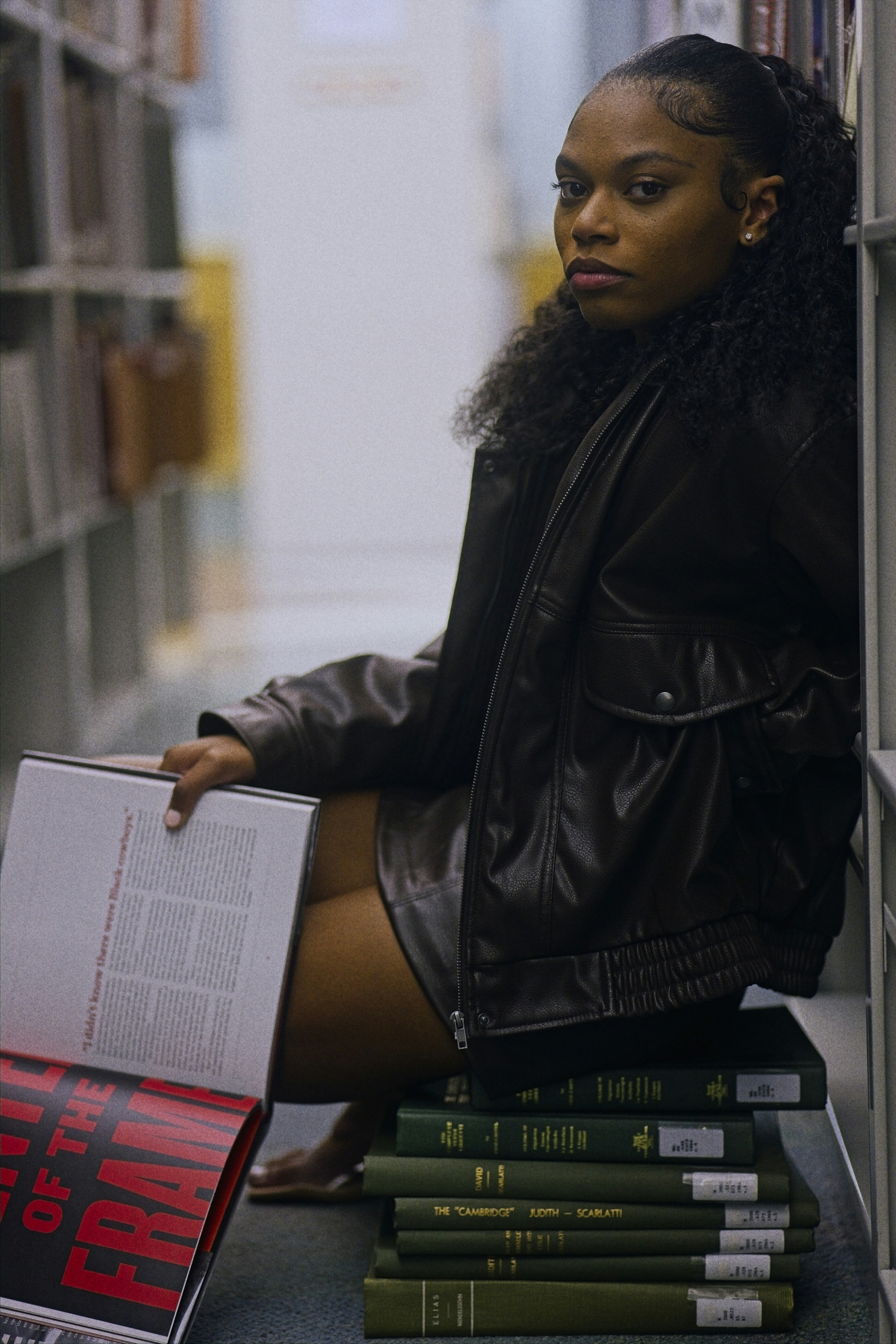 Stillness in the Aisle: A Quiet Moment Between Books and a Glance