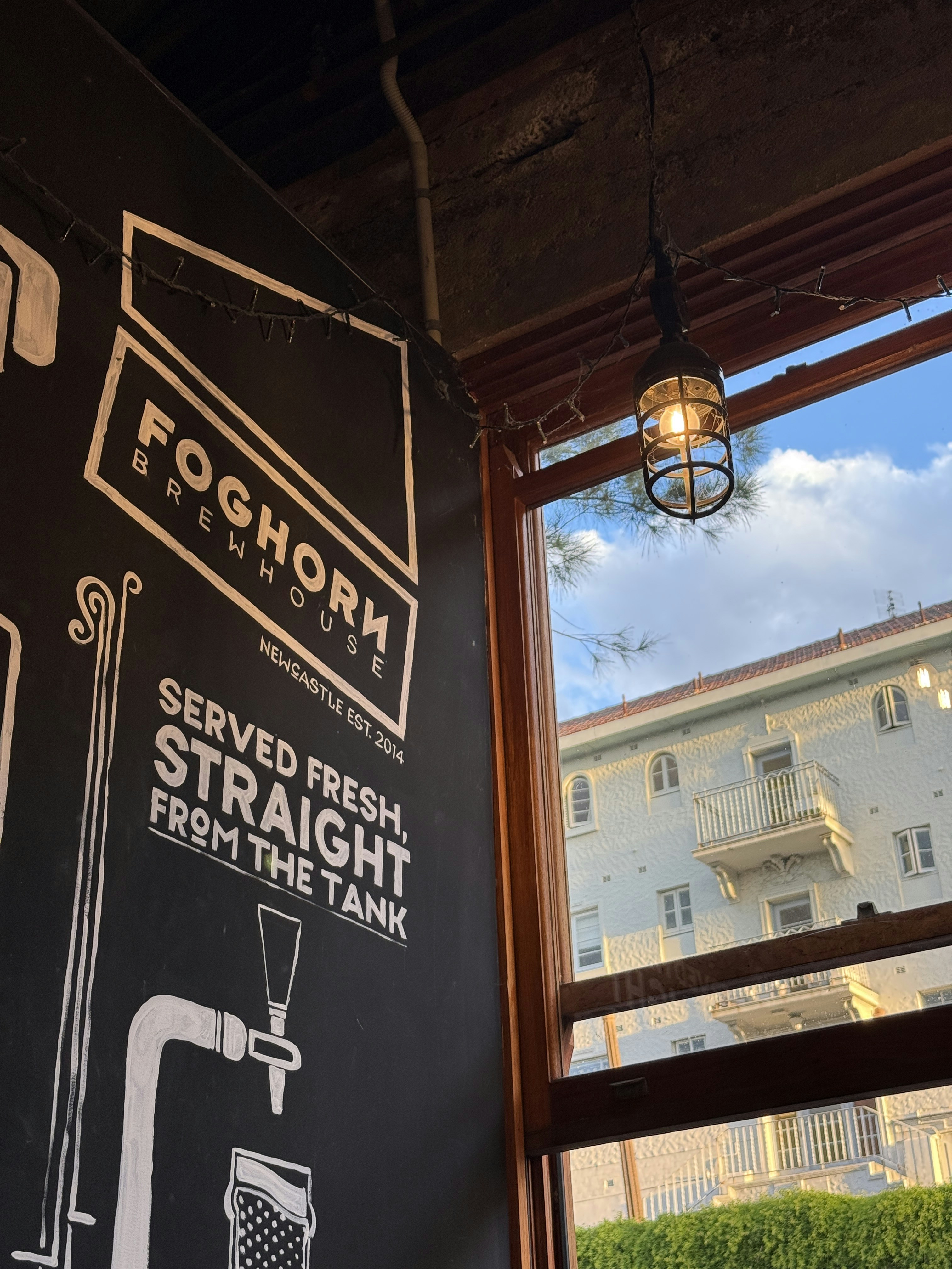 Corner Light, Corner Sign: A Sunny Brew at Fogworthy