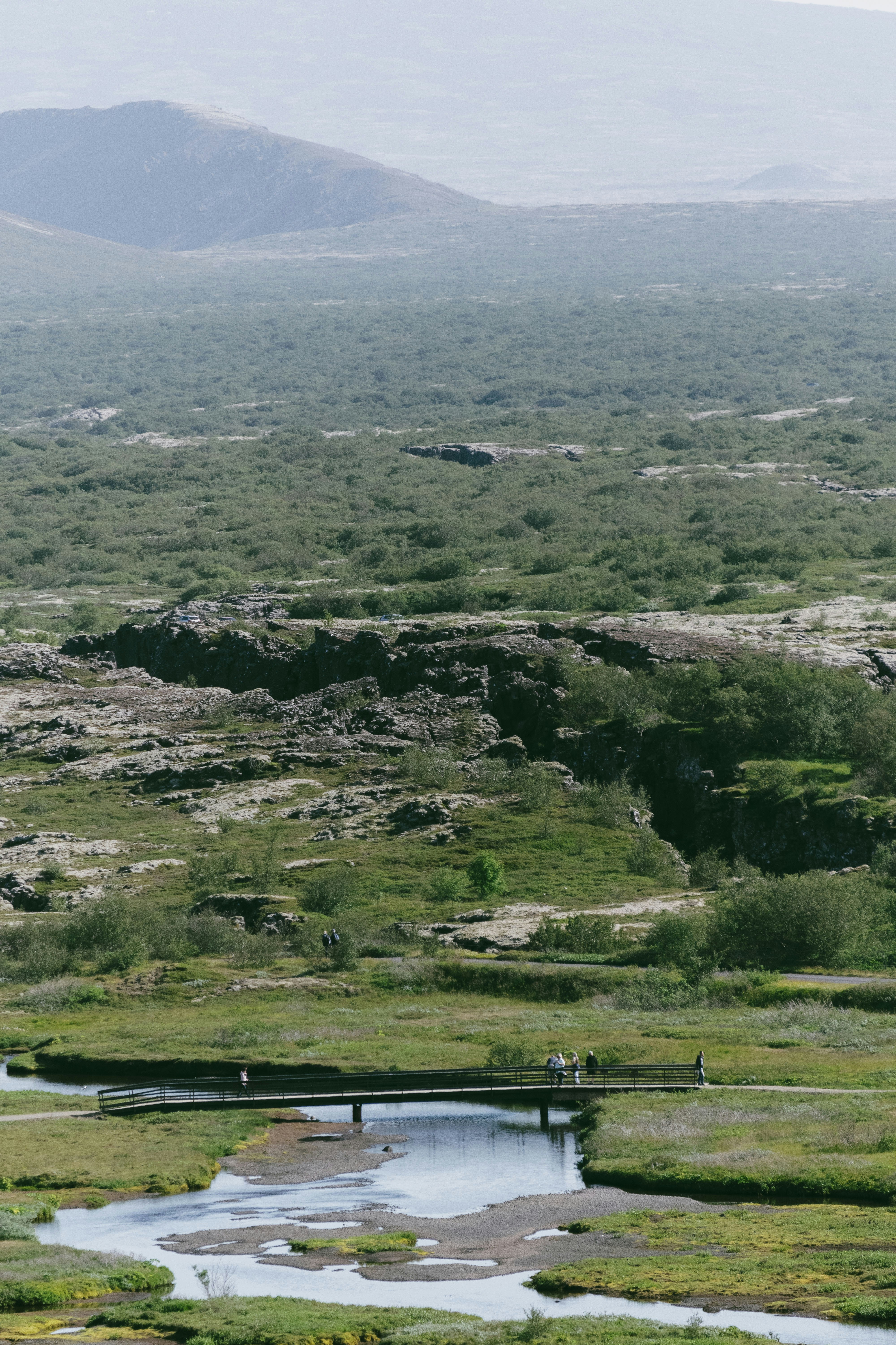 Footbridge Over Quiet Wetlands Beneath Granite Hills