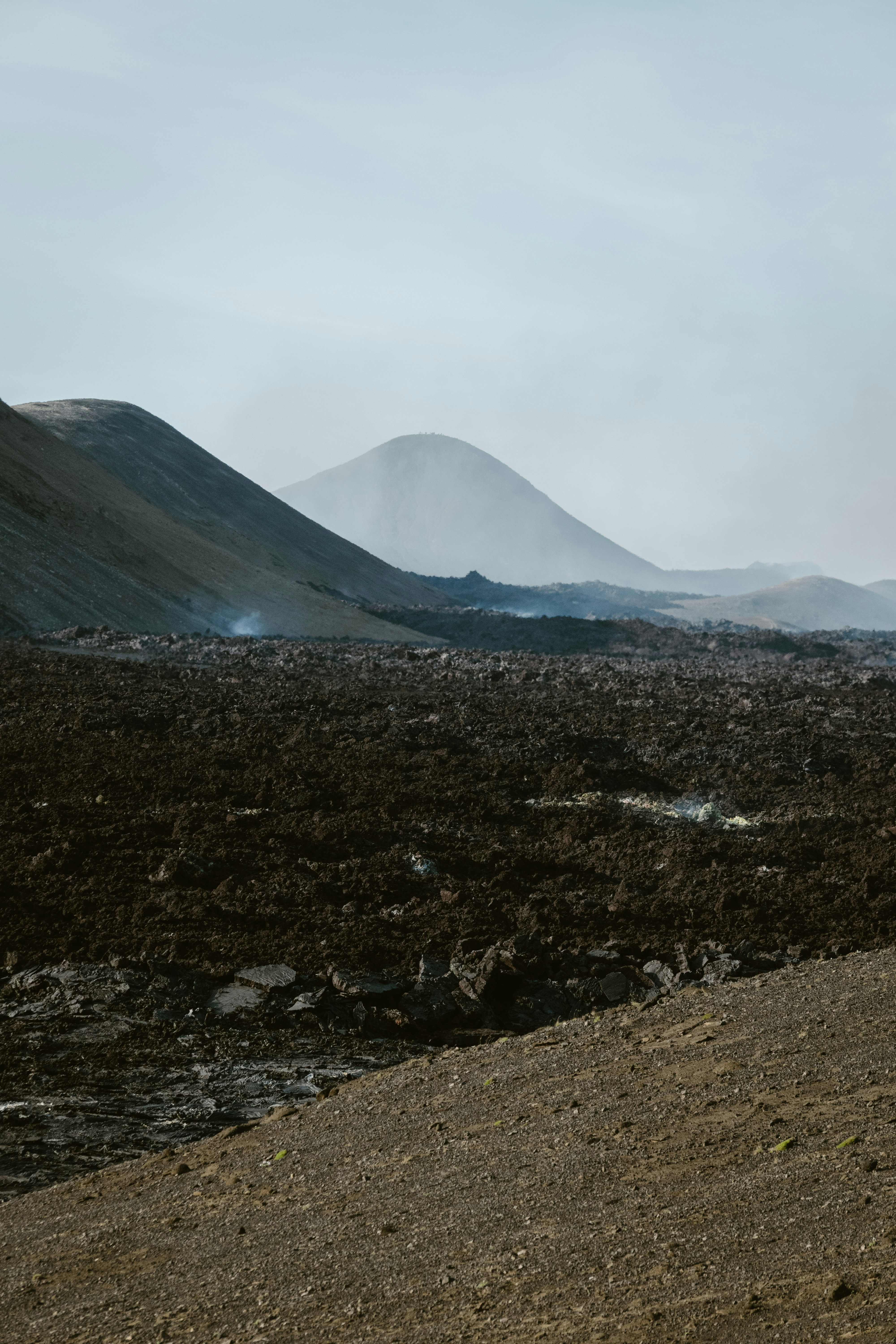 Volcanic Plain Under Quiet Skies