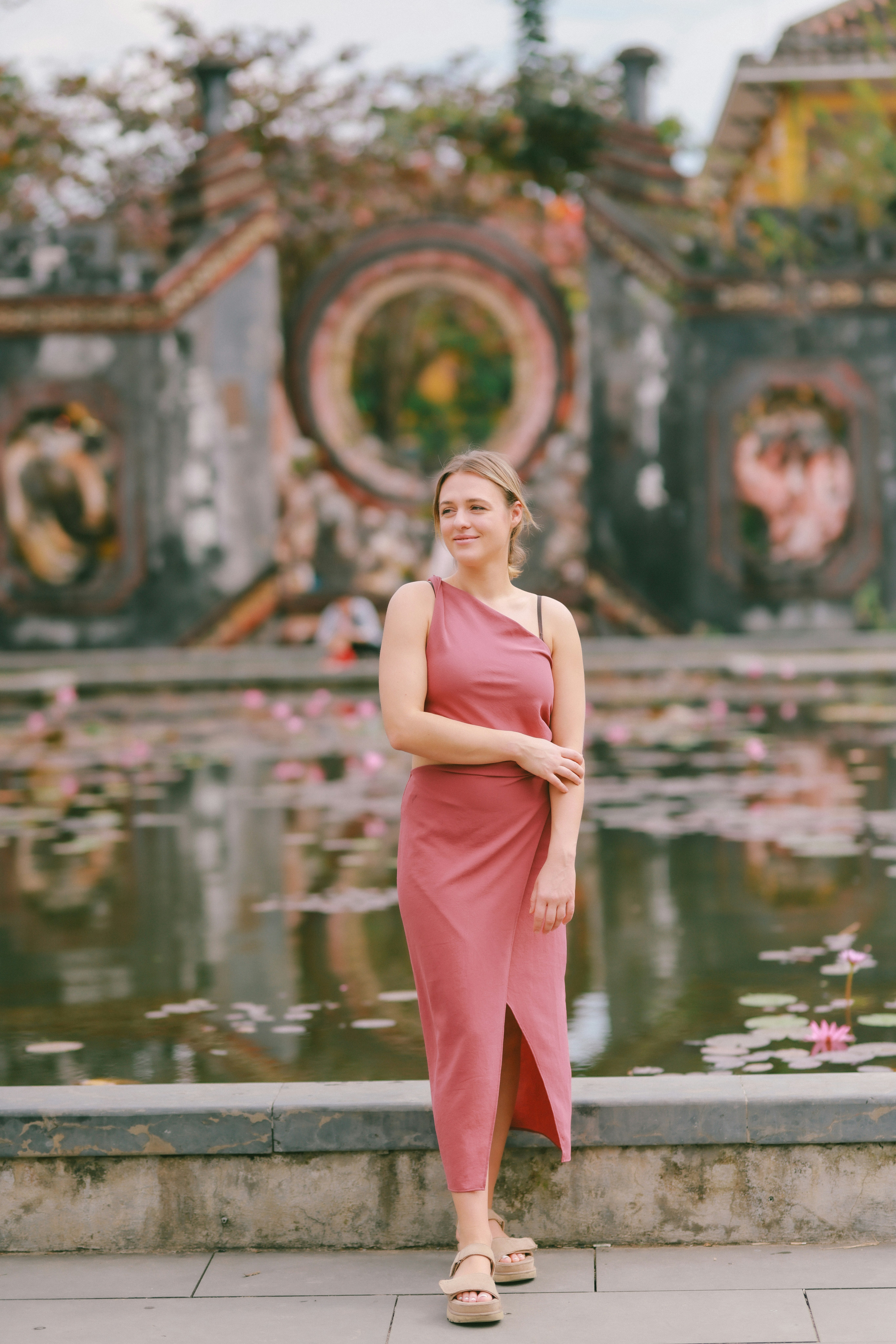 Muted Rose: A Solo Portrait by the Pond at a Historic Gate