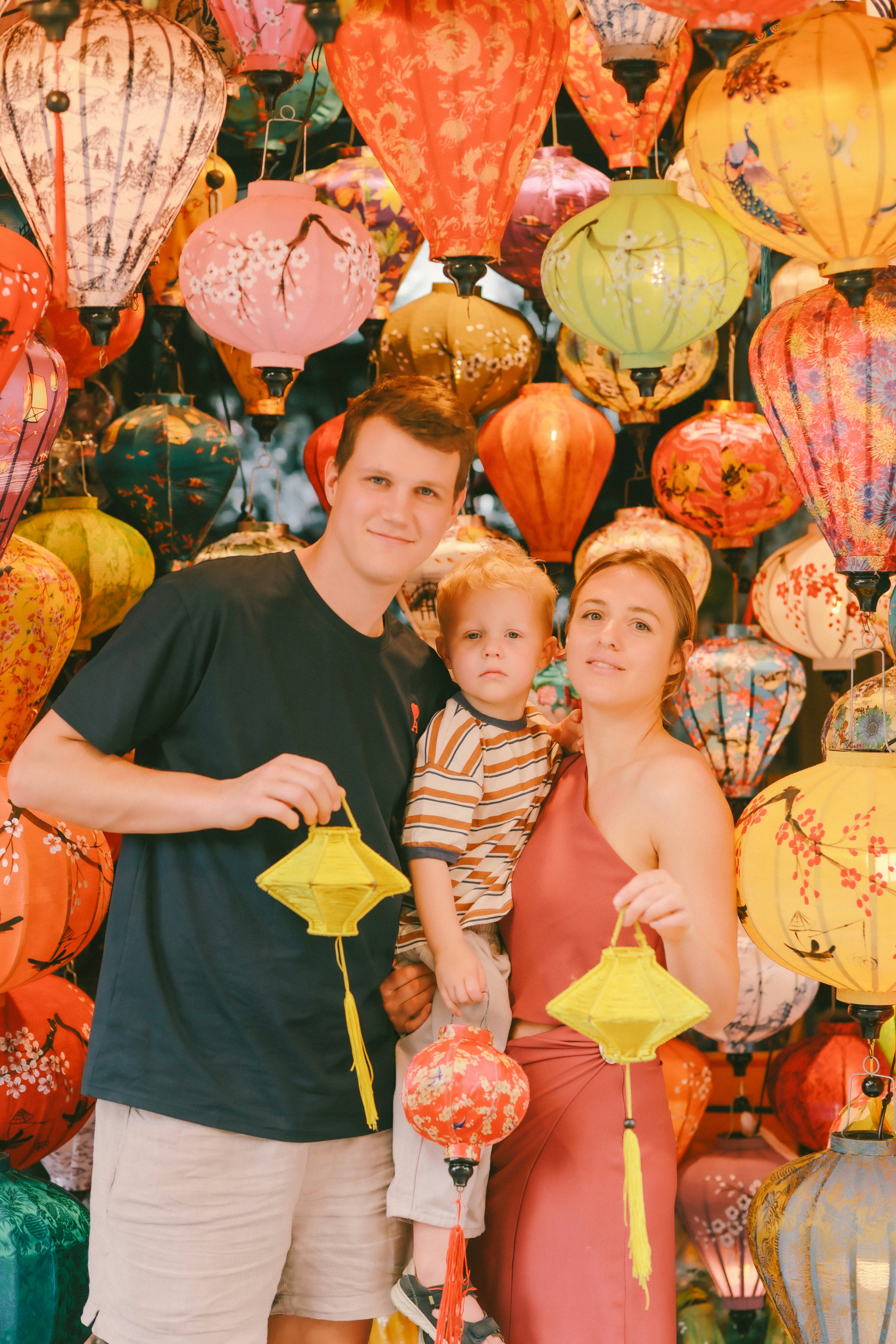 Lanterns and Light: A Family Moment Amid Floating Orbs