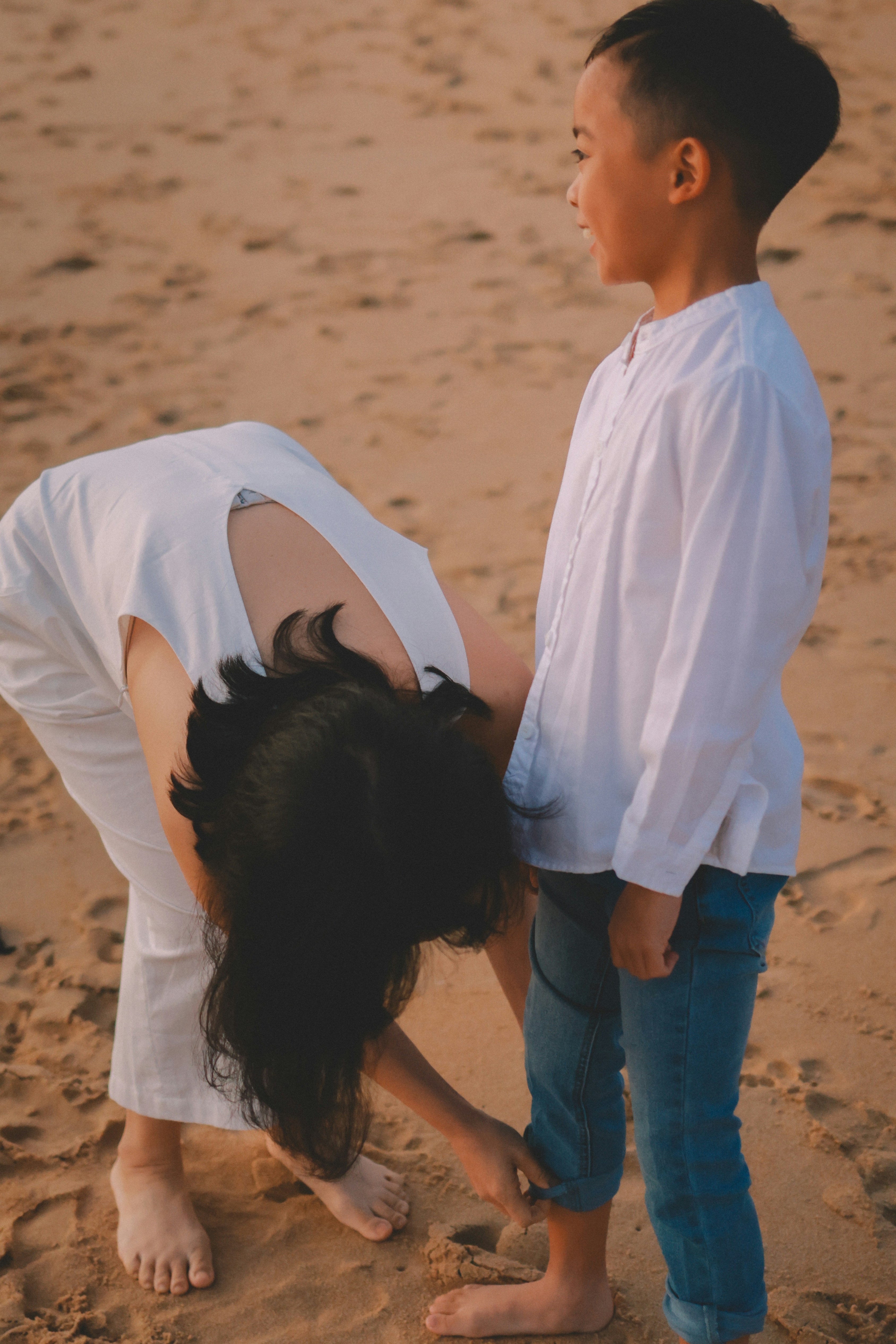 Two guardians of the shoreline: a sunlit moment between siblings