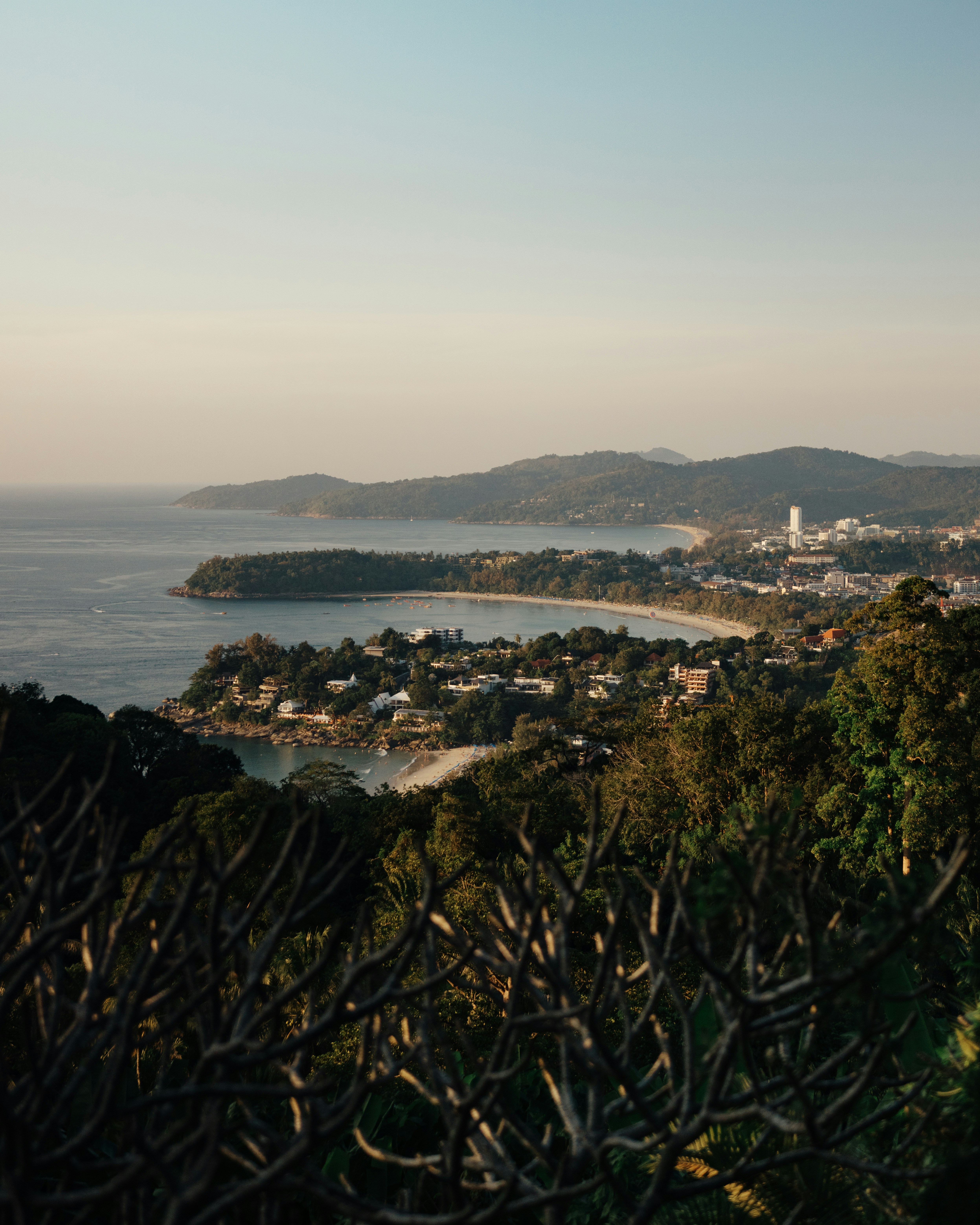 Sunlit Harbor Valley: A Coastal Town Unfolding Across Gentle Hills