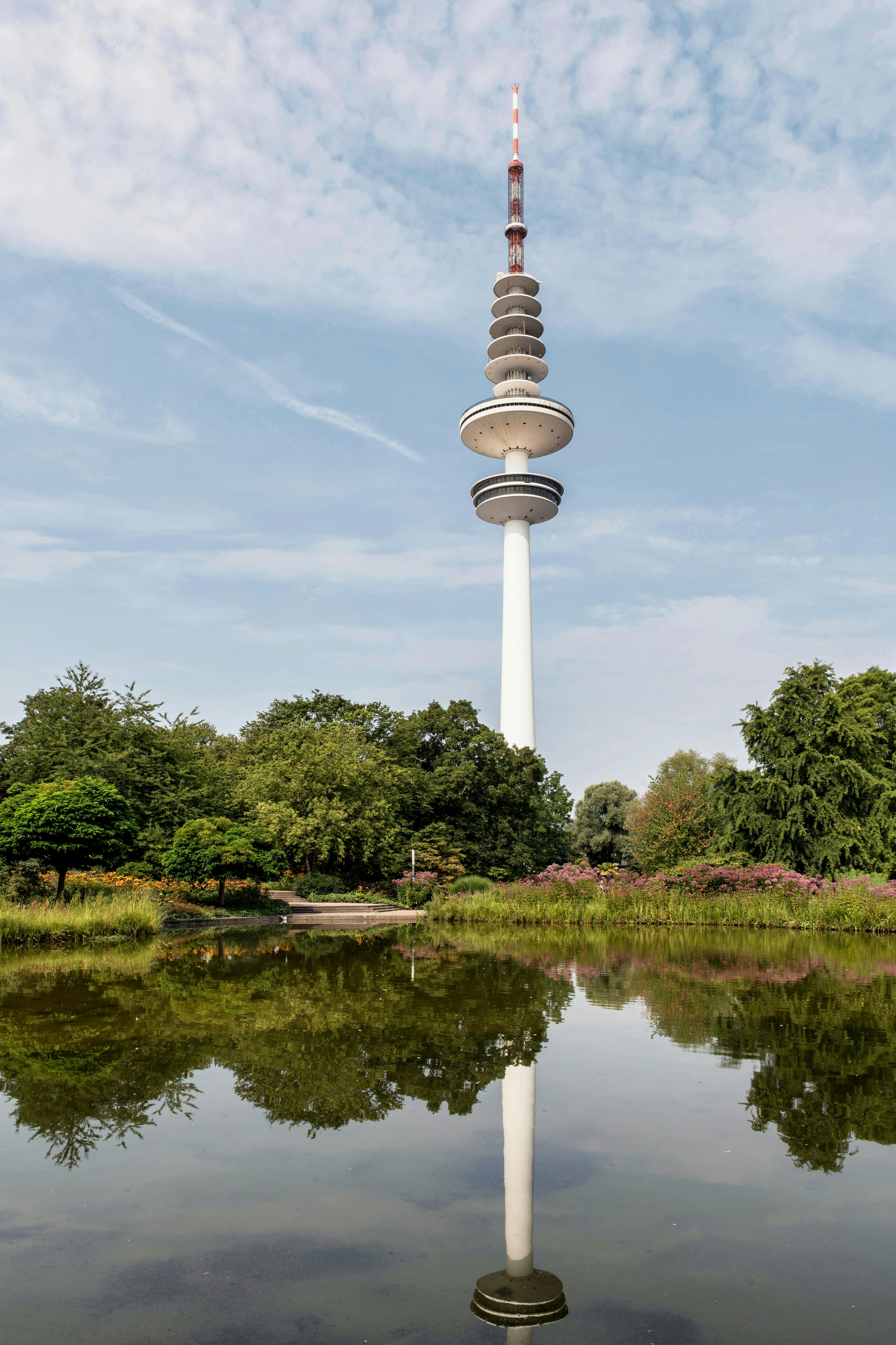 Tower Reflected: City Landmark Rising Over Silk Waters