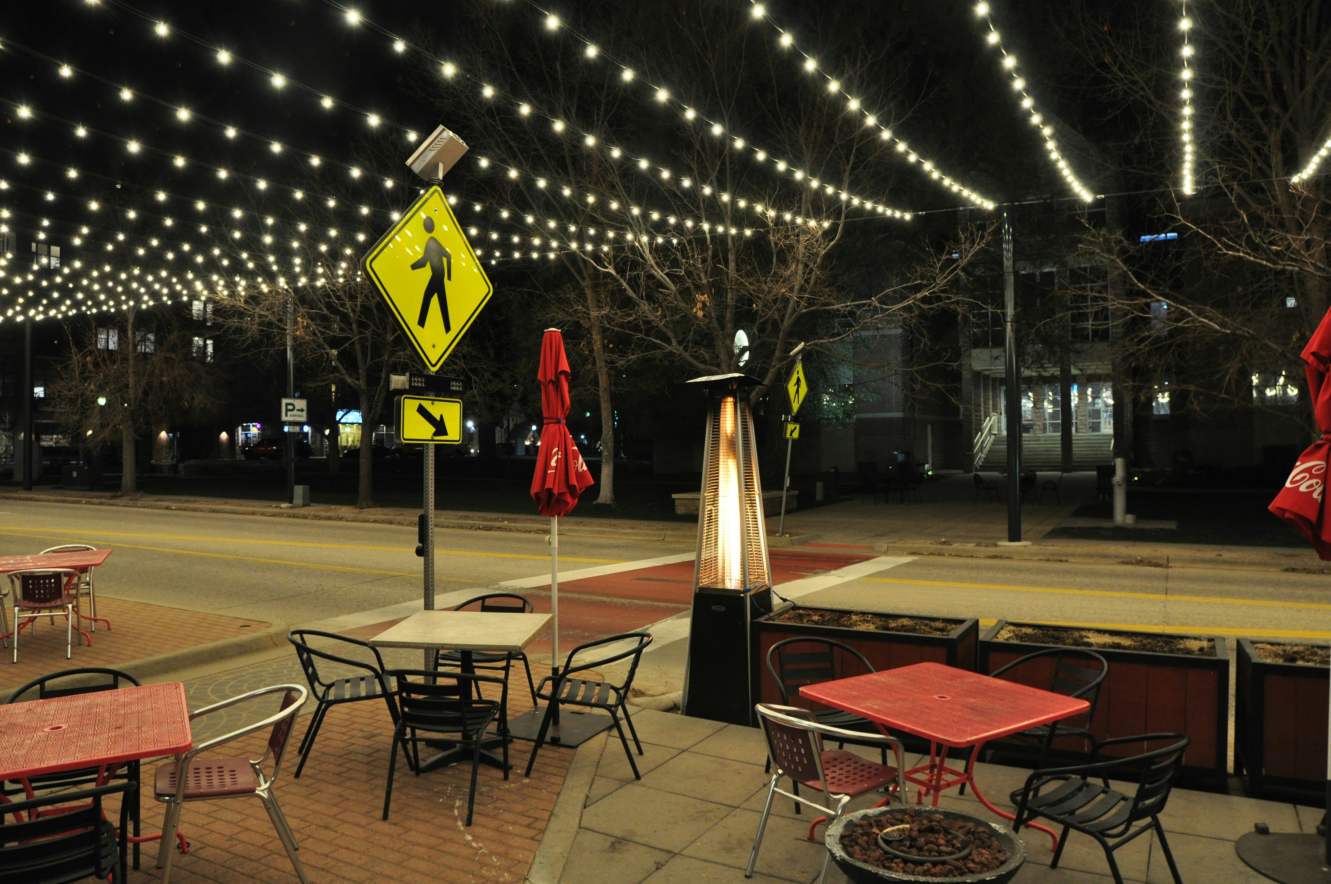 Evening Street Café Under String Lights