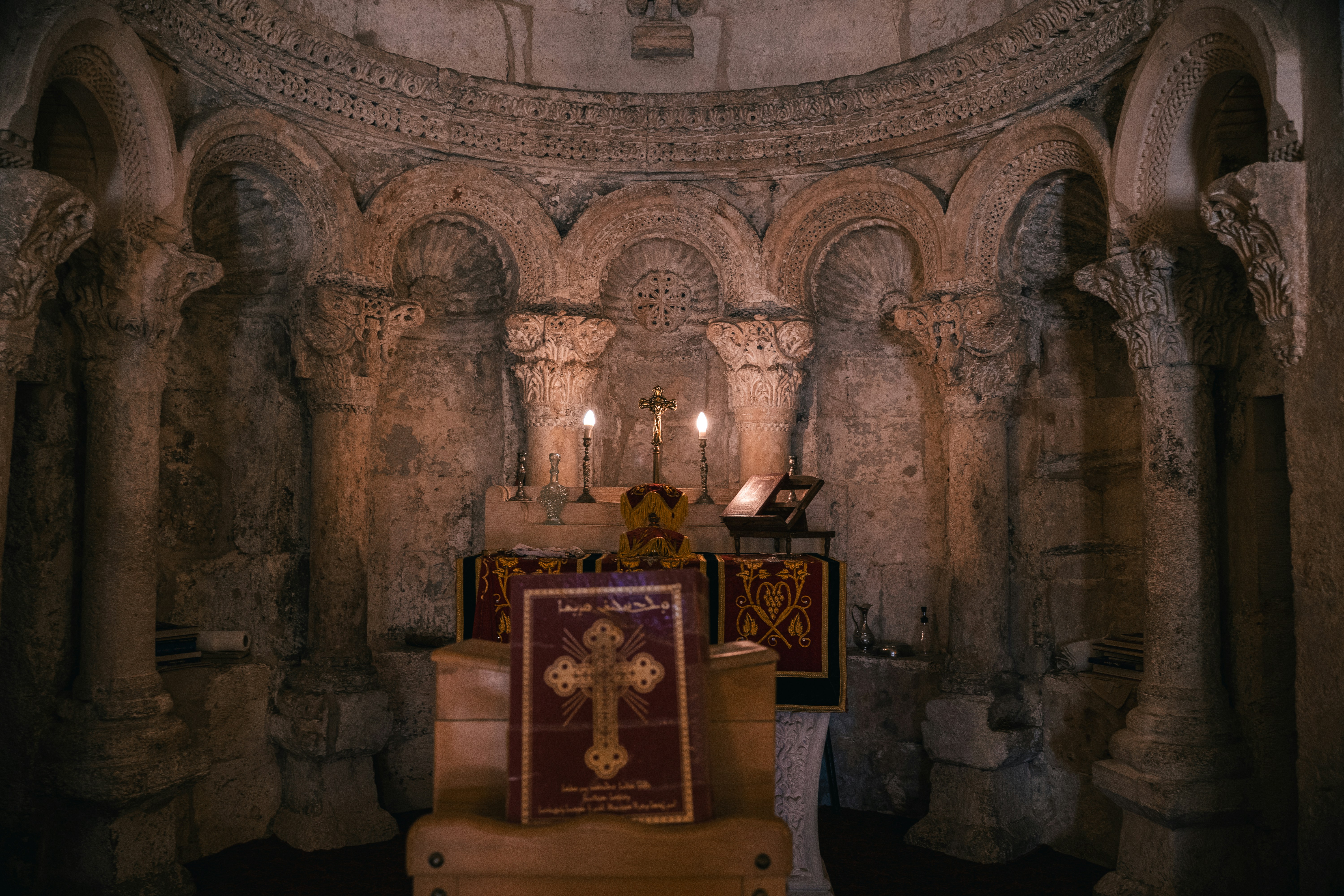 Candles over the Ancient Altar: Light in the Carved Crypt