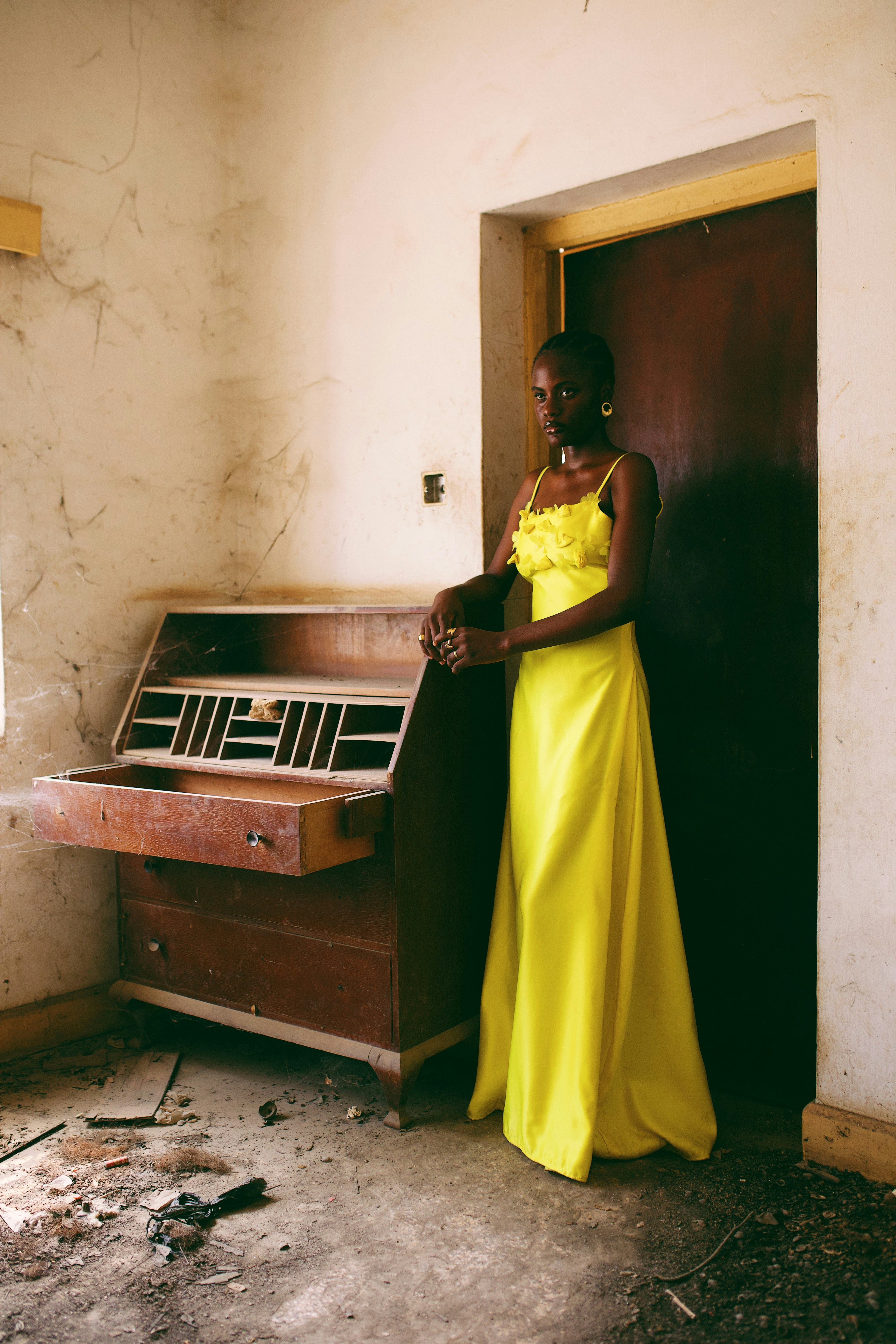Yellow Gown in the Threshold: A Portrait of Quiet Resolve