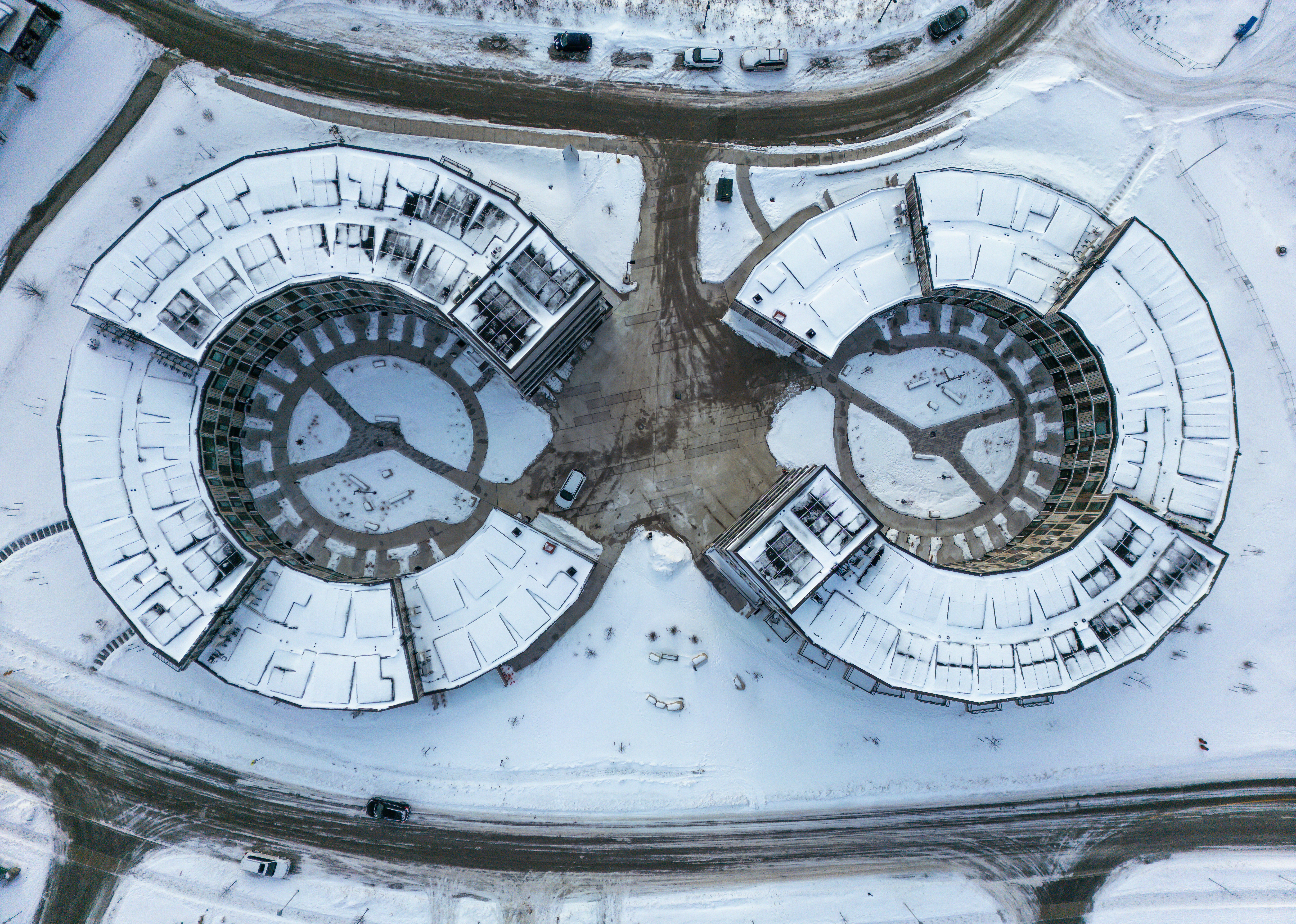 Twin Circular Campus Echoes Under Fresh Snow
