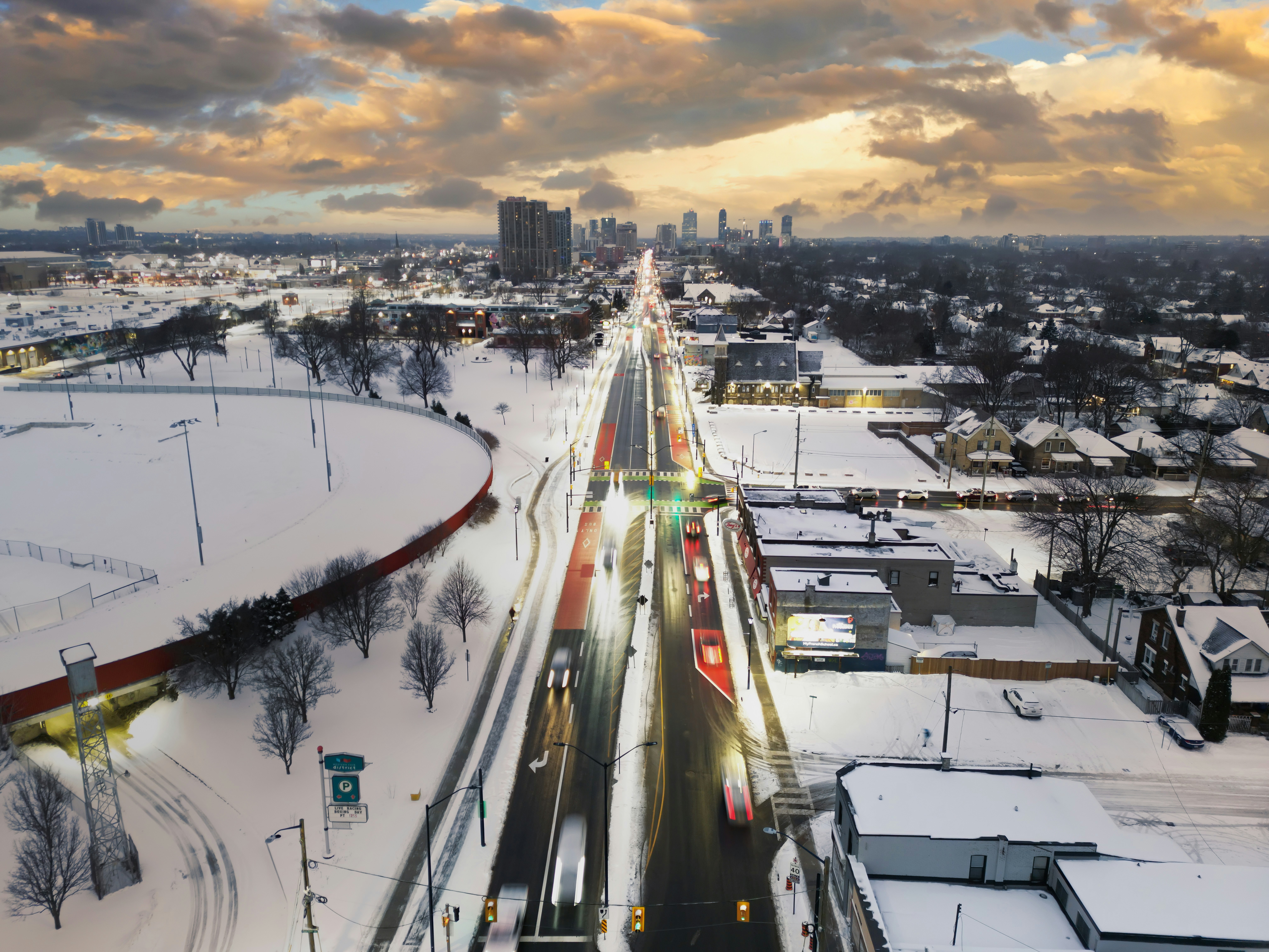 Snowbound Boulevard: Aerial View Through Winter City Glow