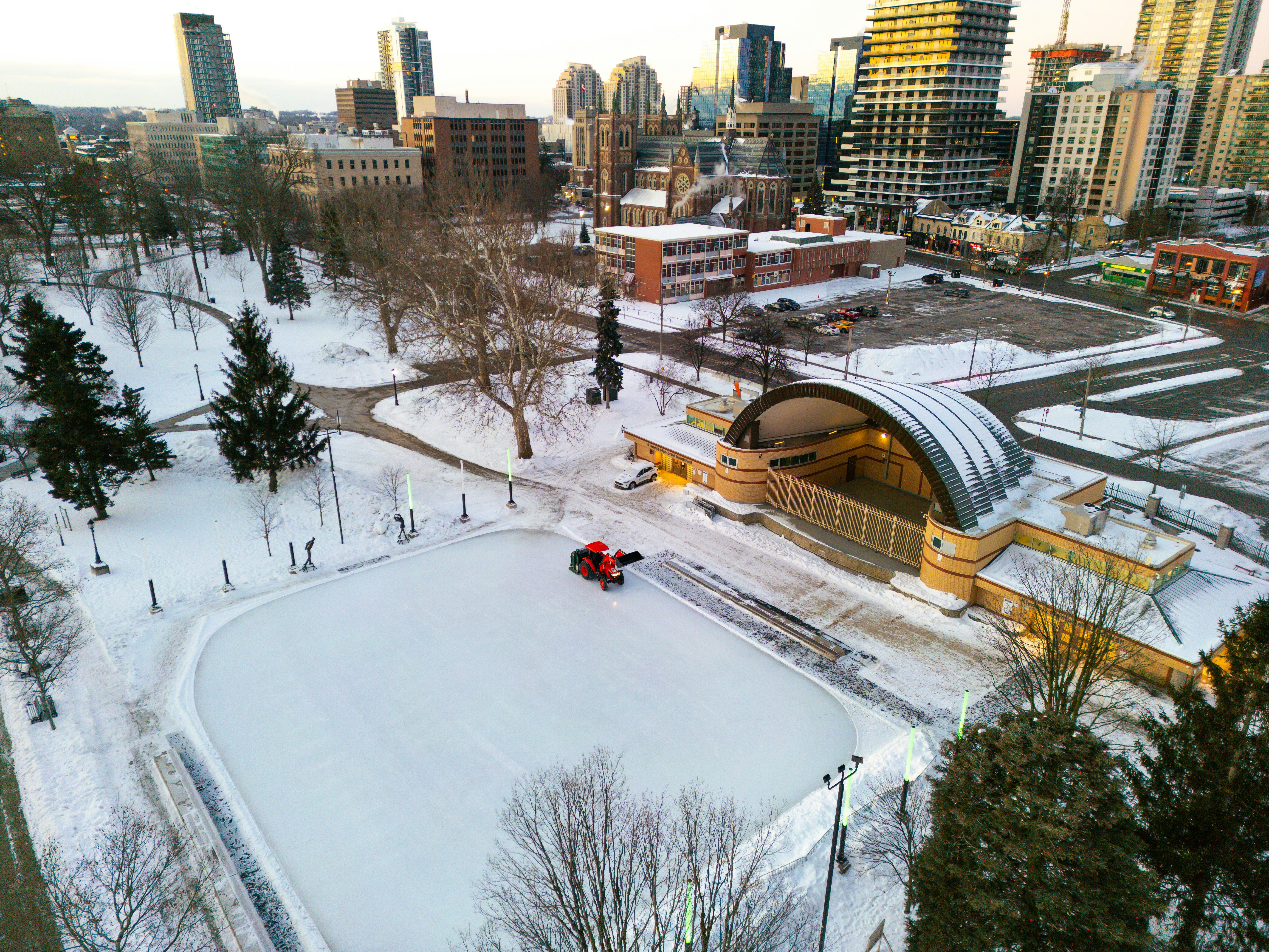 City Snowfall Over the Ice: A Quiet Park Welcome Mat