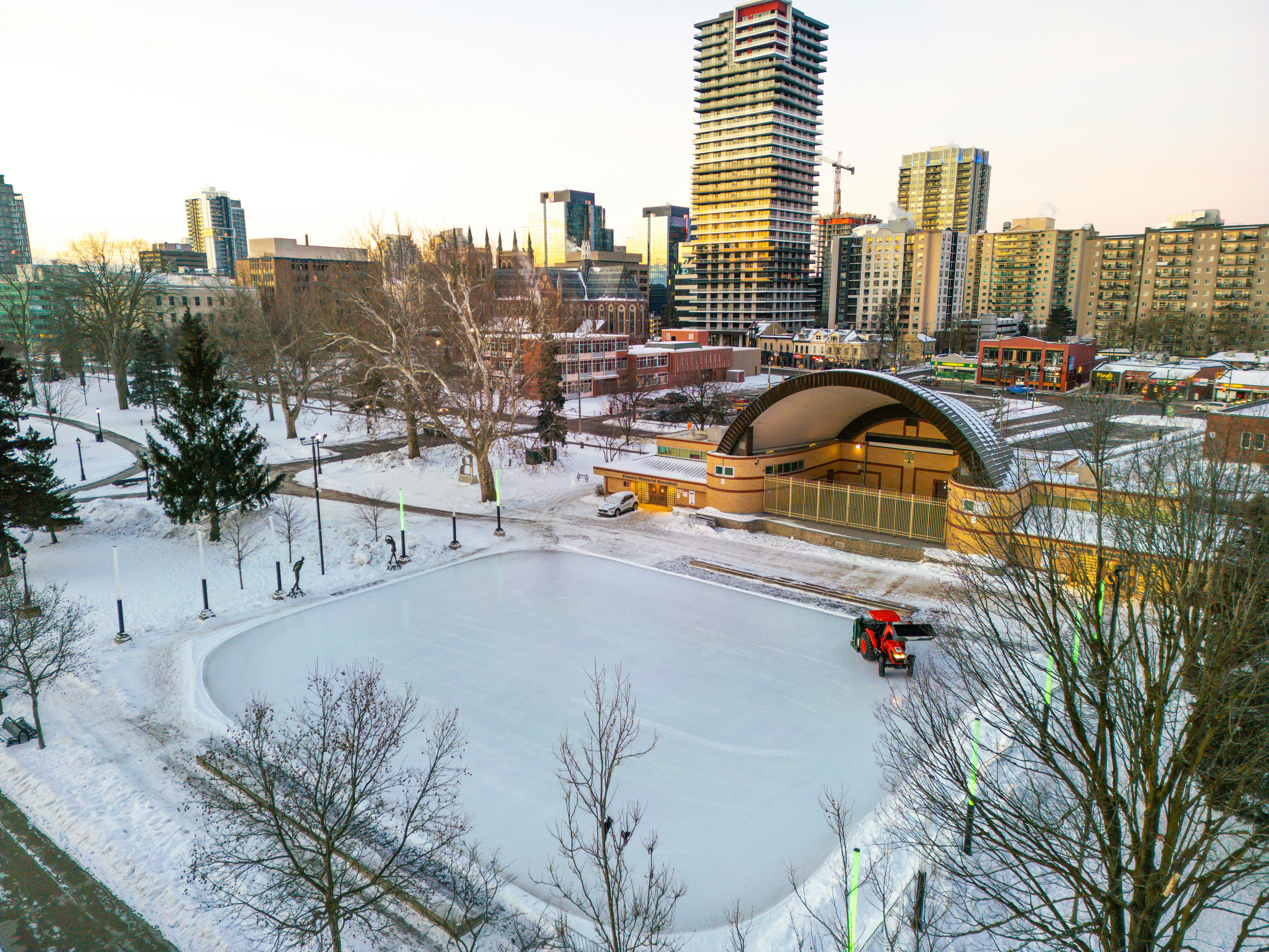 Winter Ring: A City Park Ice Rink Resting Under Tall Glass