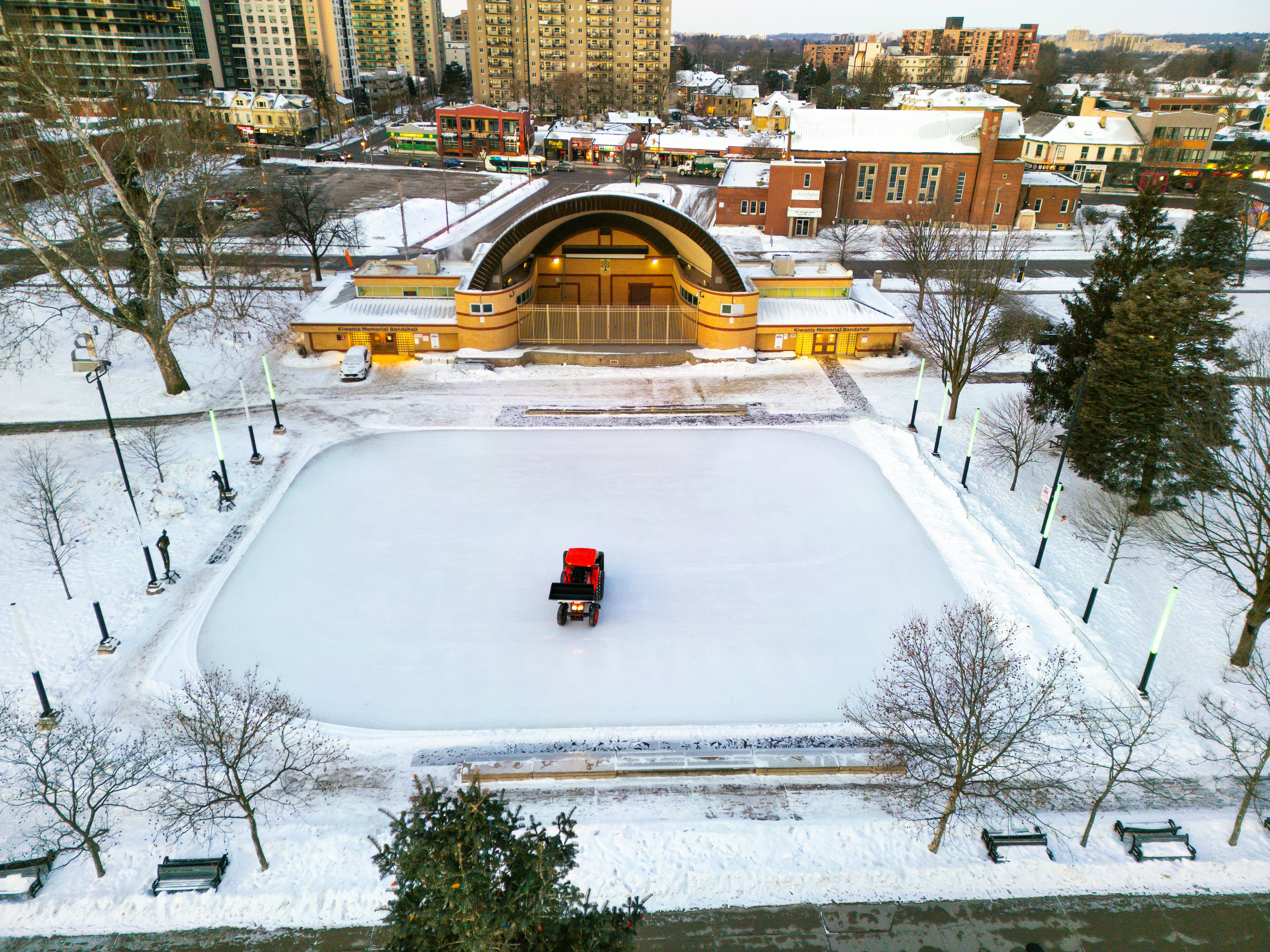 Winter Ice Arena: A Red Tractor on a Frozen Stage