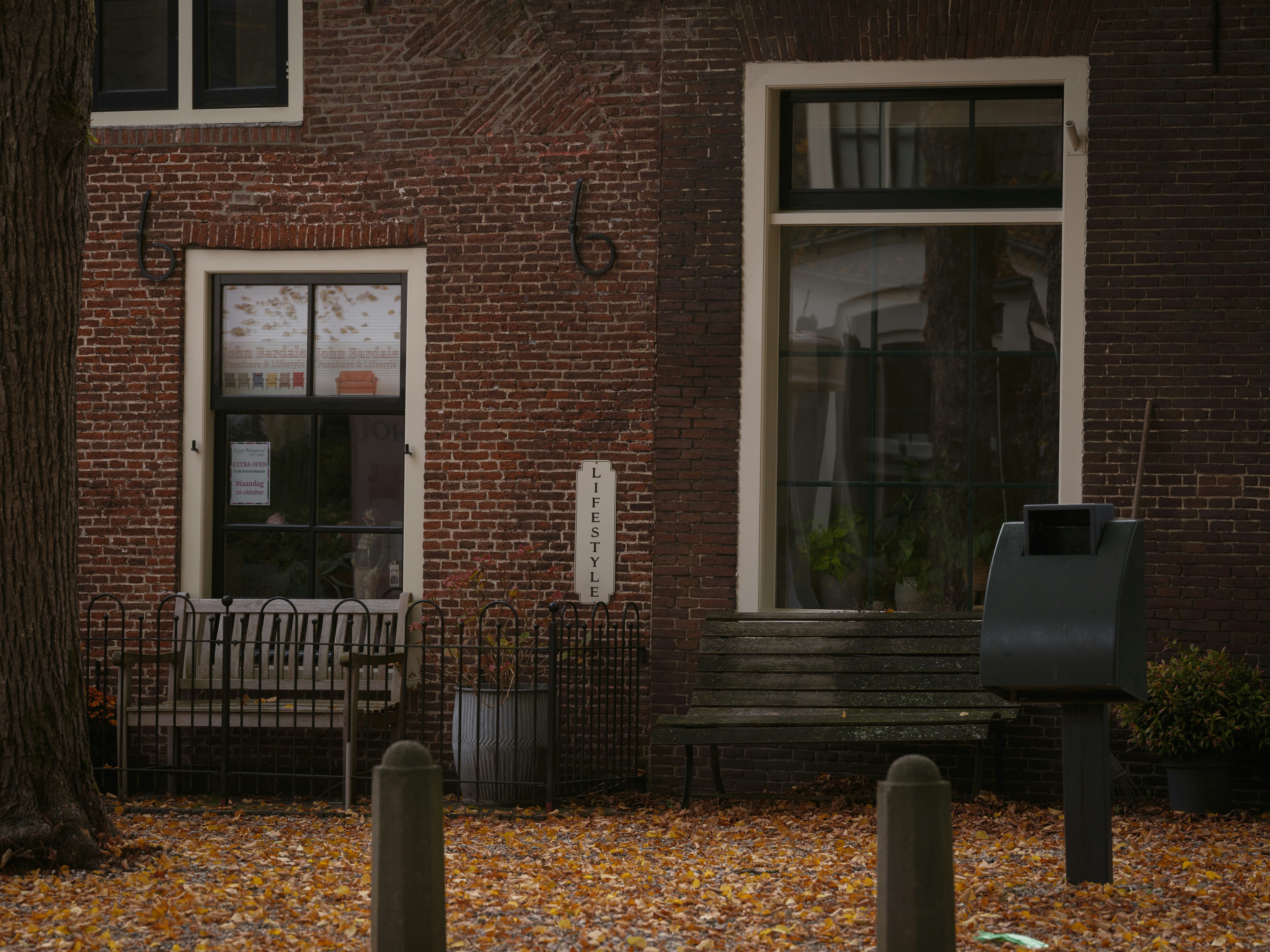 Autumn Quiet: Brick Facade and Urban Porch