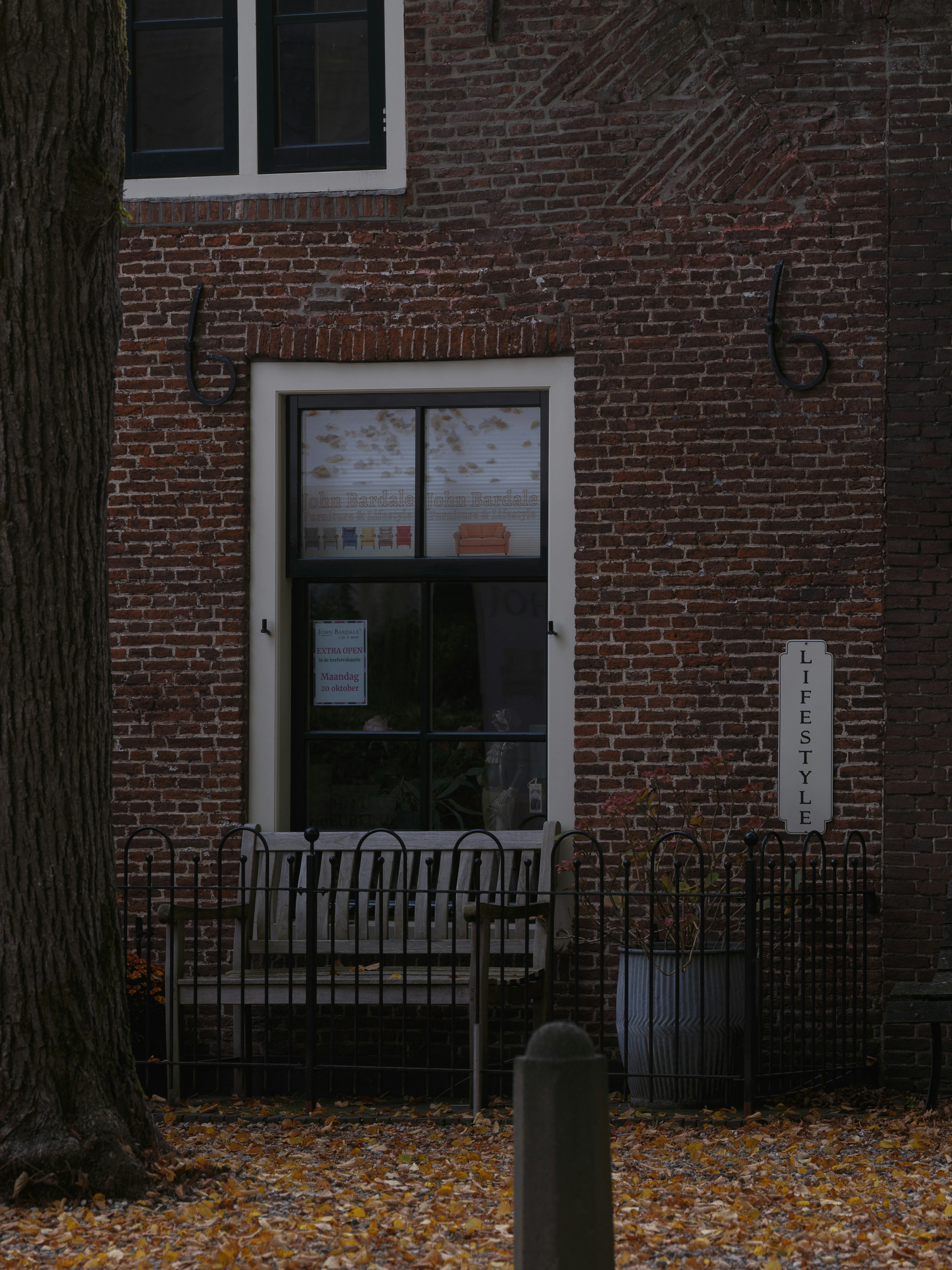 Brick Facade with Central Doorway and Windowed Details