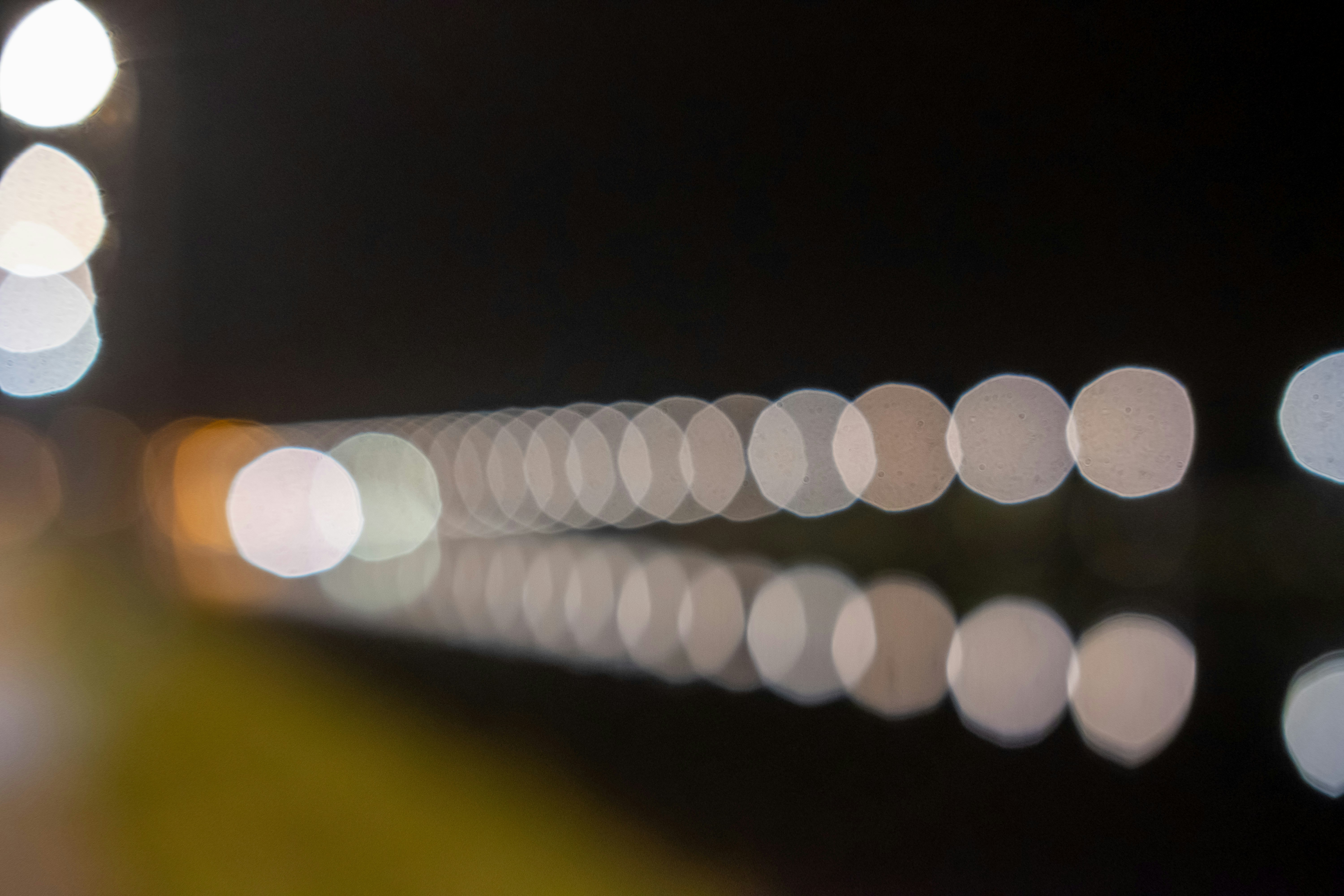 Night Concrete Horizon: Orbs on a Quiet Waterfront