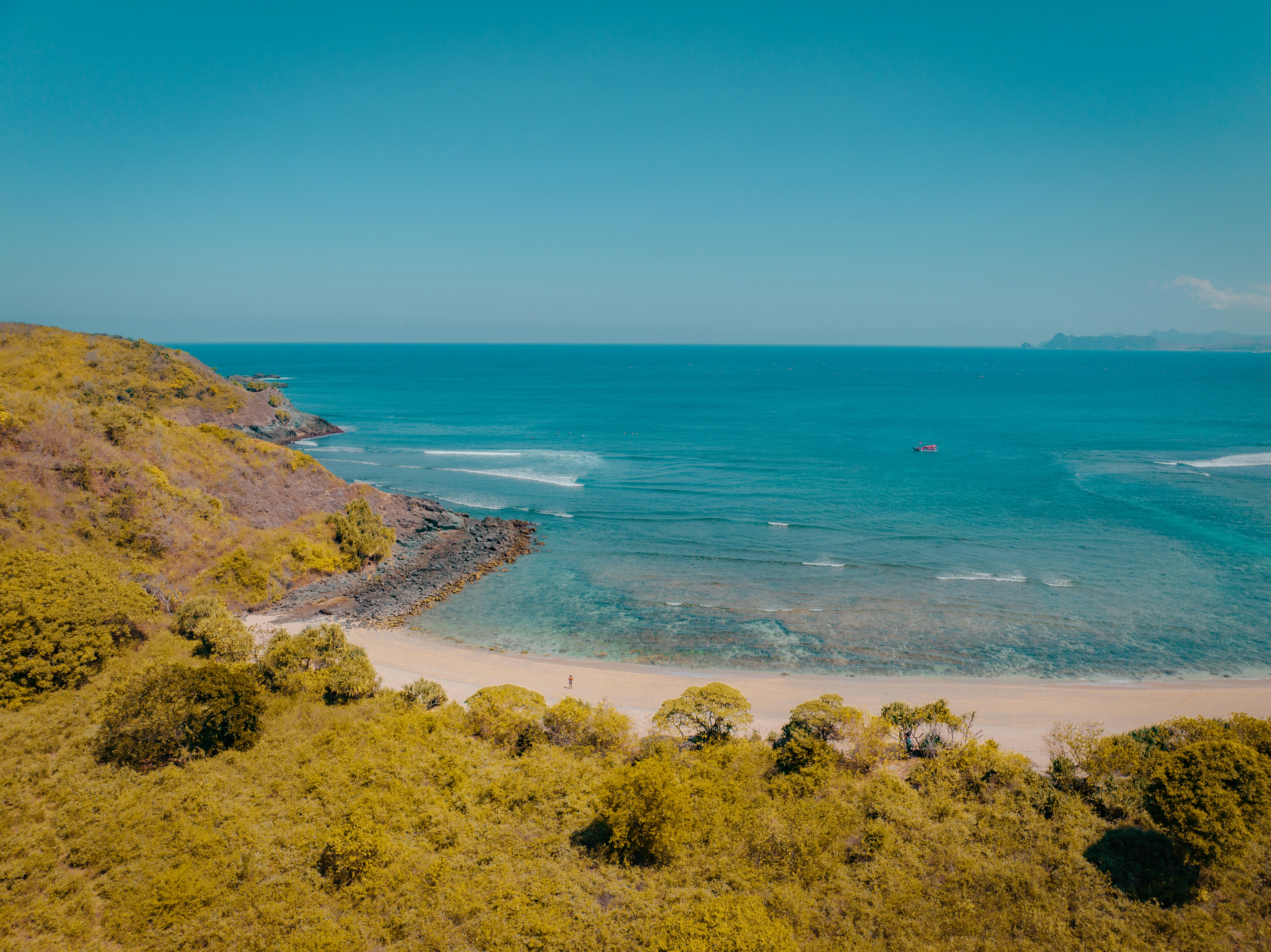 Golden Shoreline: Aerial Quiet Over a Sunlit Cove