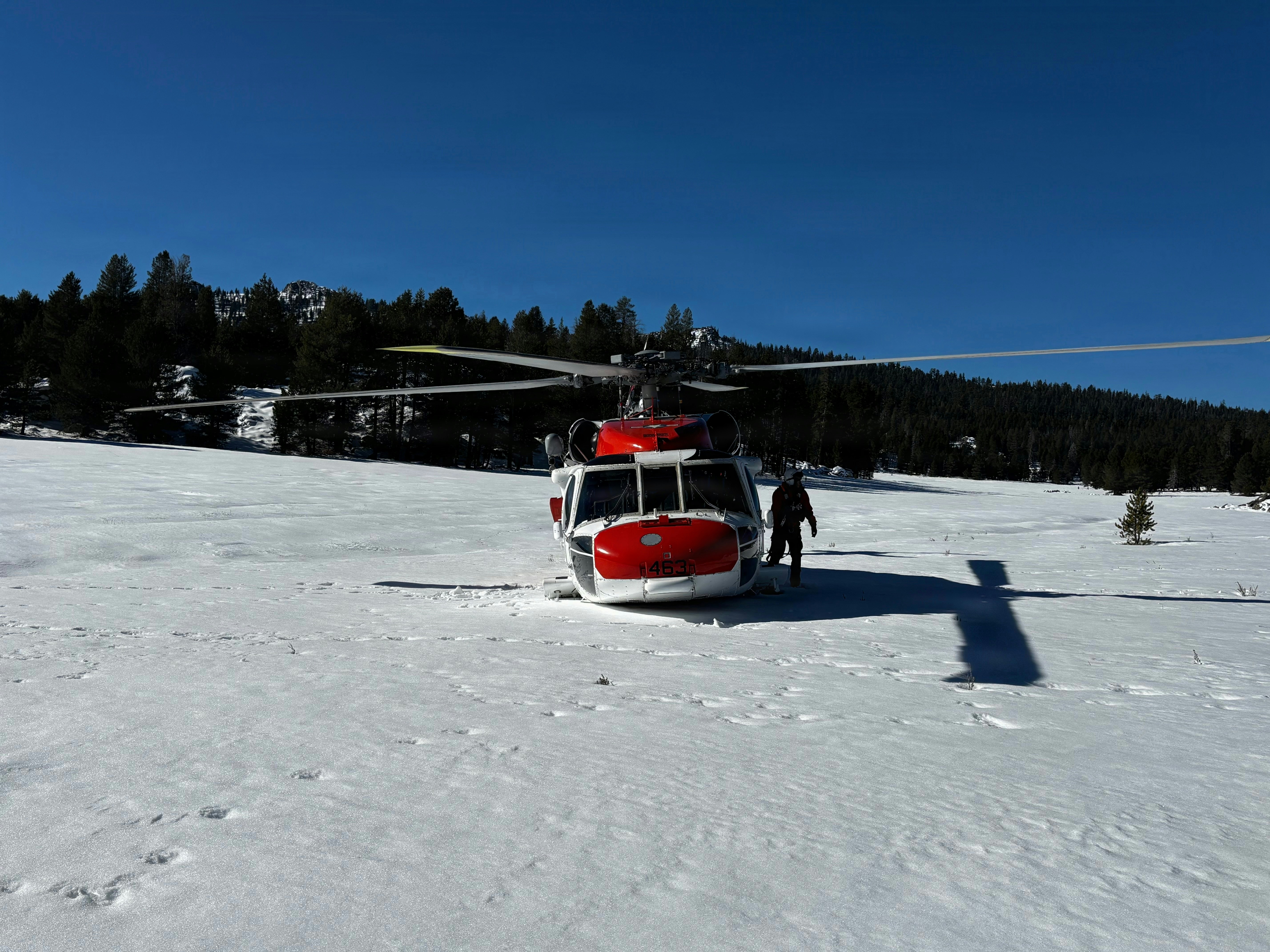 Snowfield Rescue: A Red-Front Helicopter on Silent White