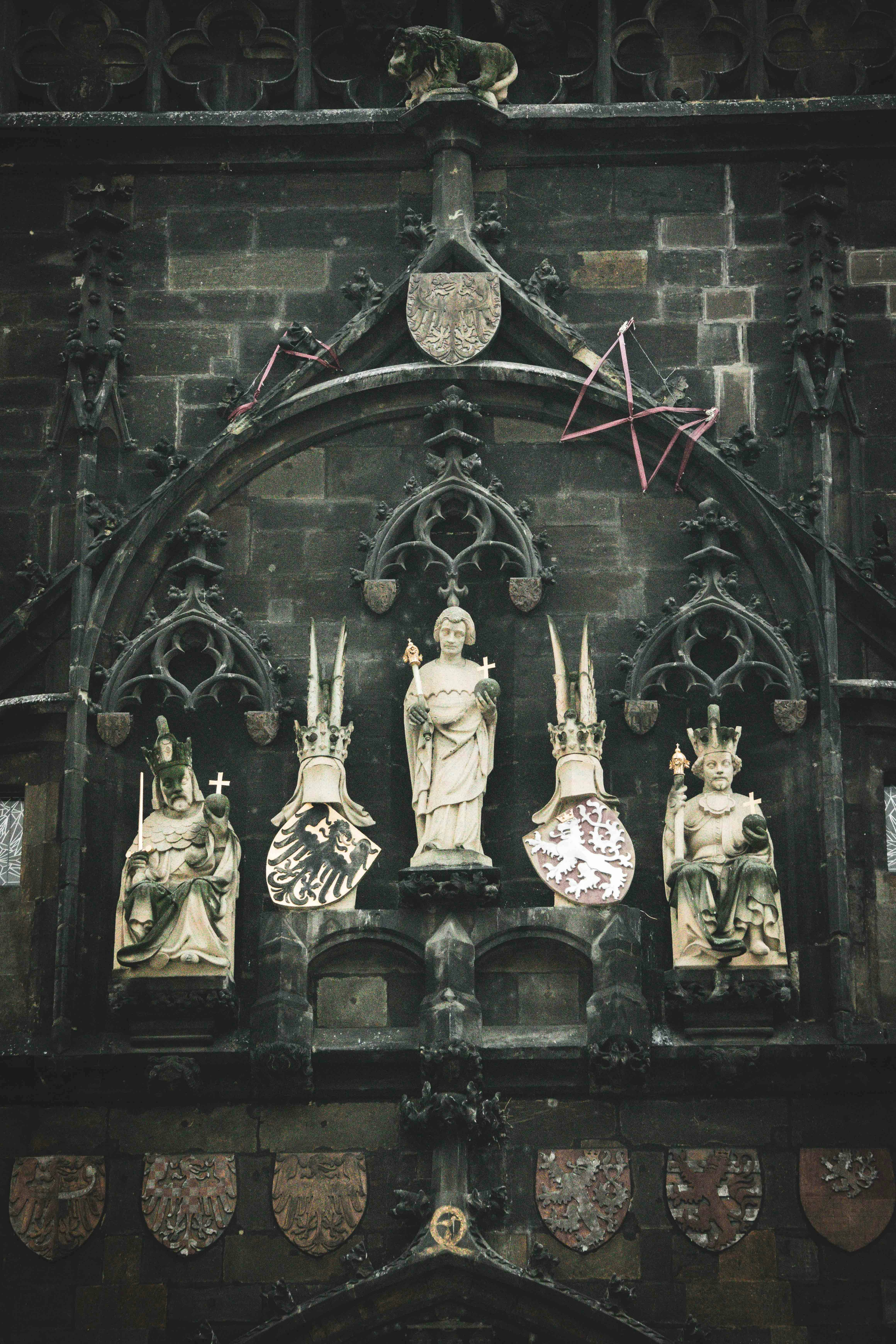 Gothic architectural details with statues and shields. photo – Free ...