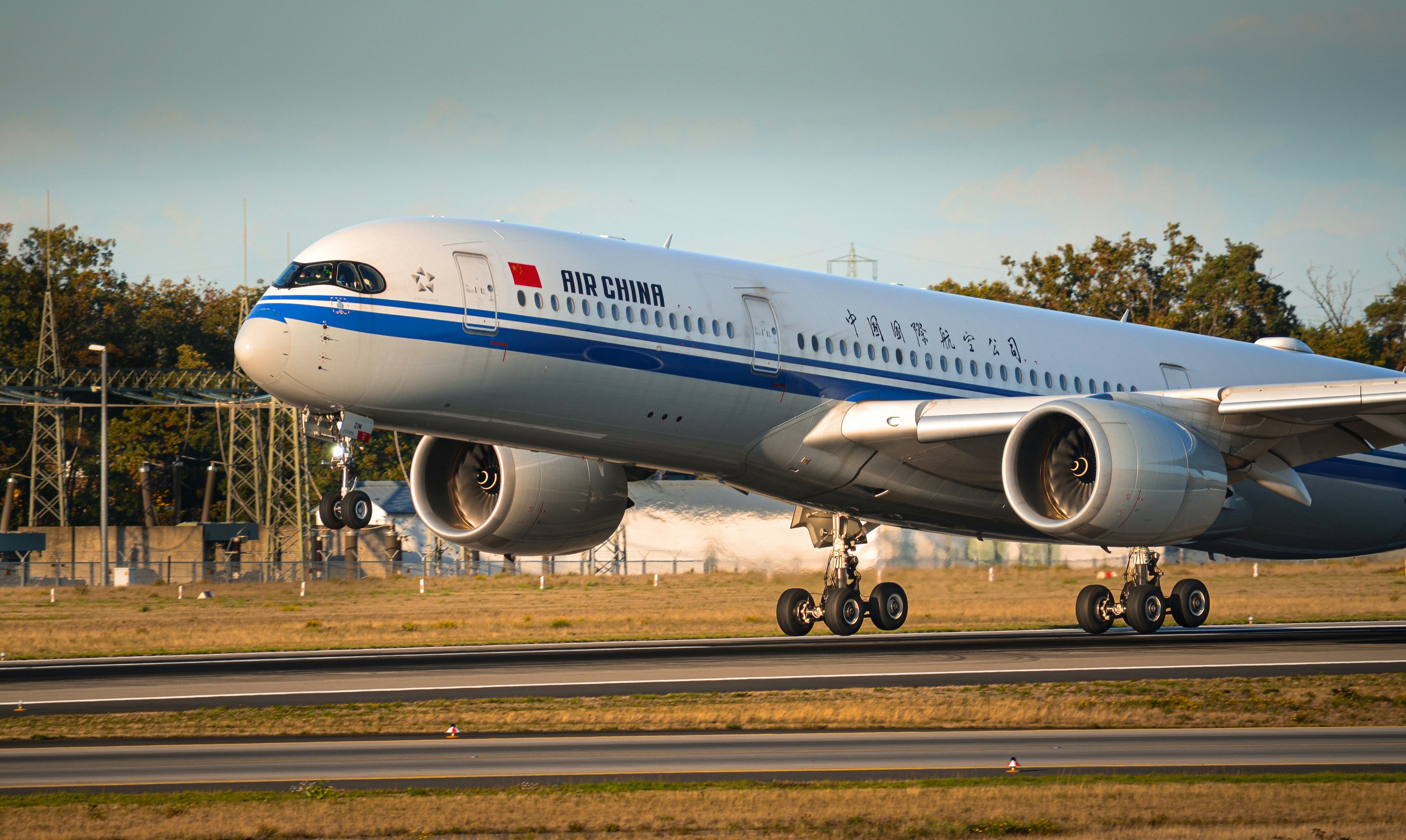 Air China undercarriage kiss: a wide-body touch on the runway