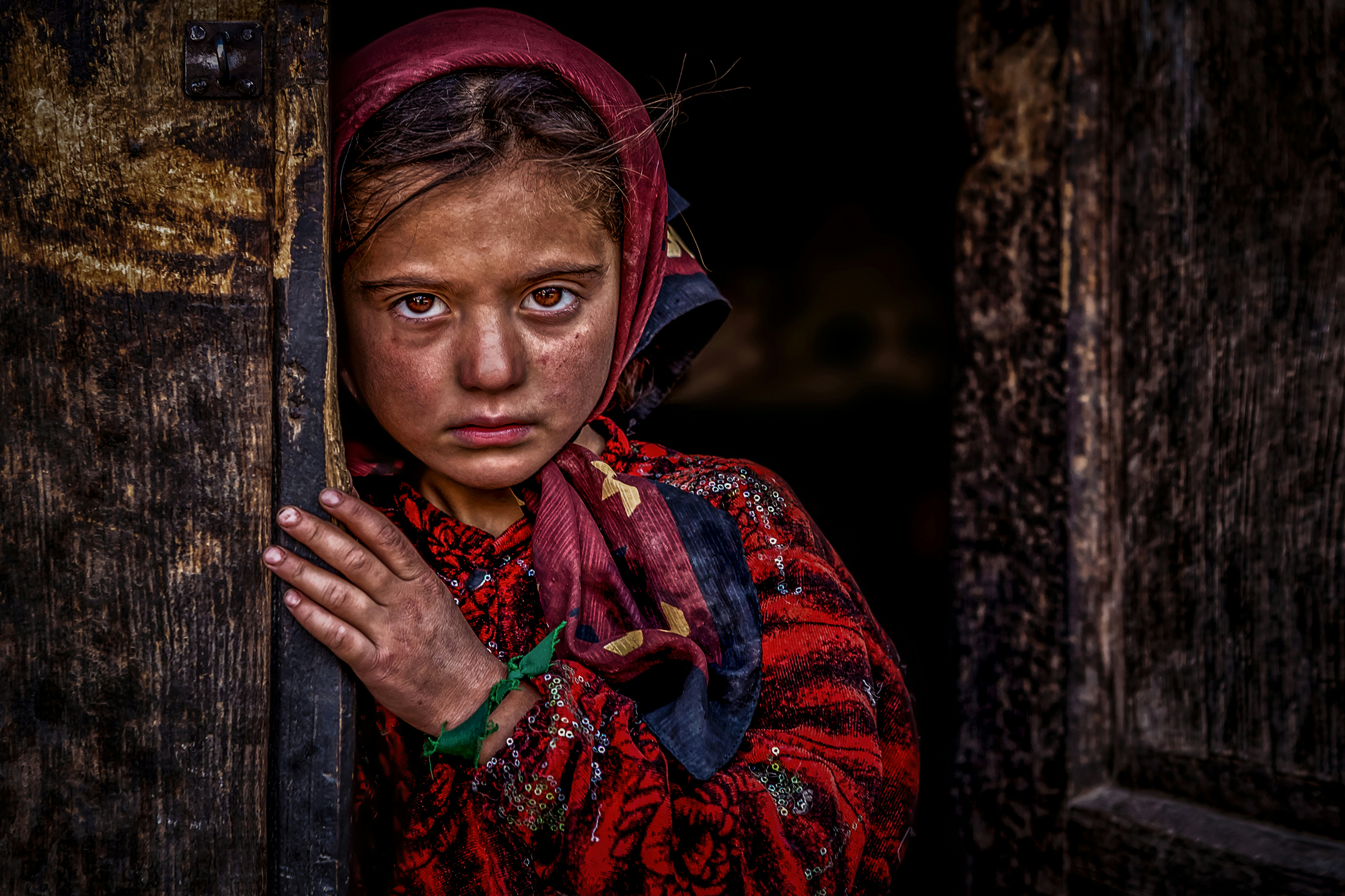 Girl at the Threshold: A Window into Quiet Resolve