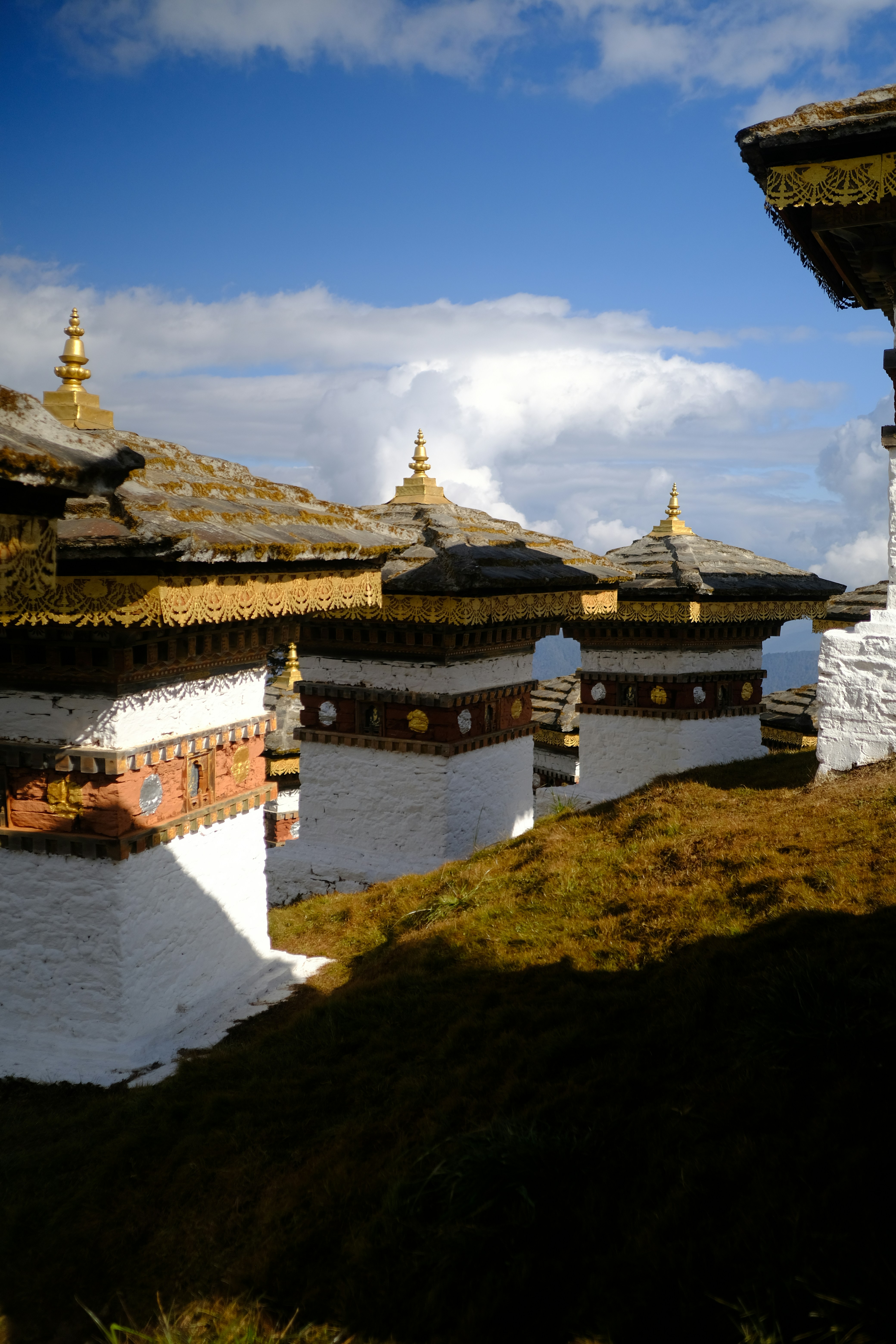 Stone Stupa Row Beneath a Clear Himalayan Sky