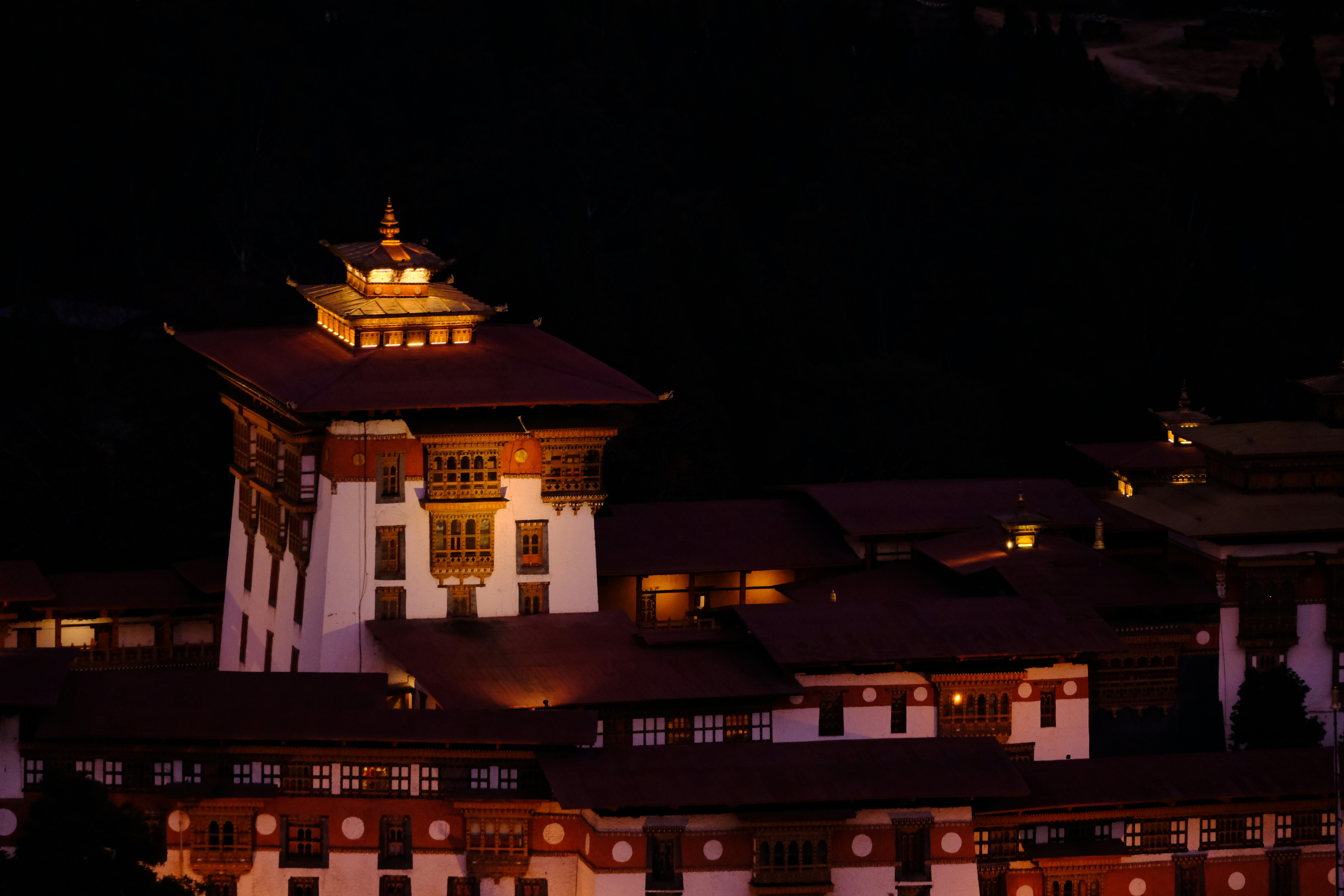 Lone pagoda Lanterns: Nightfall Over the Dzong Architecture