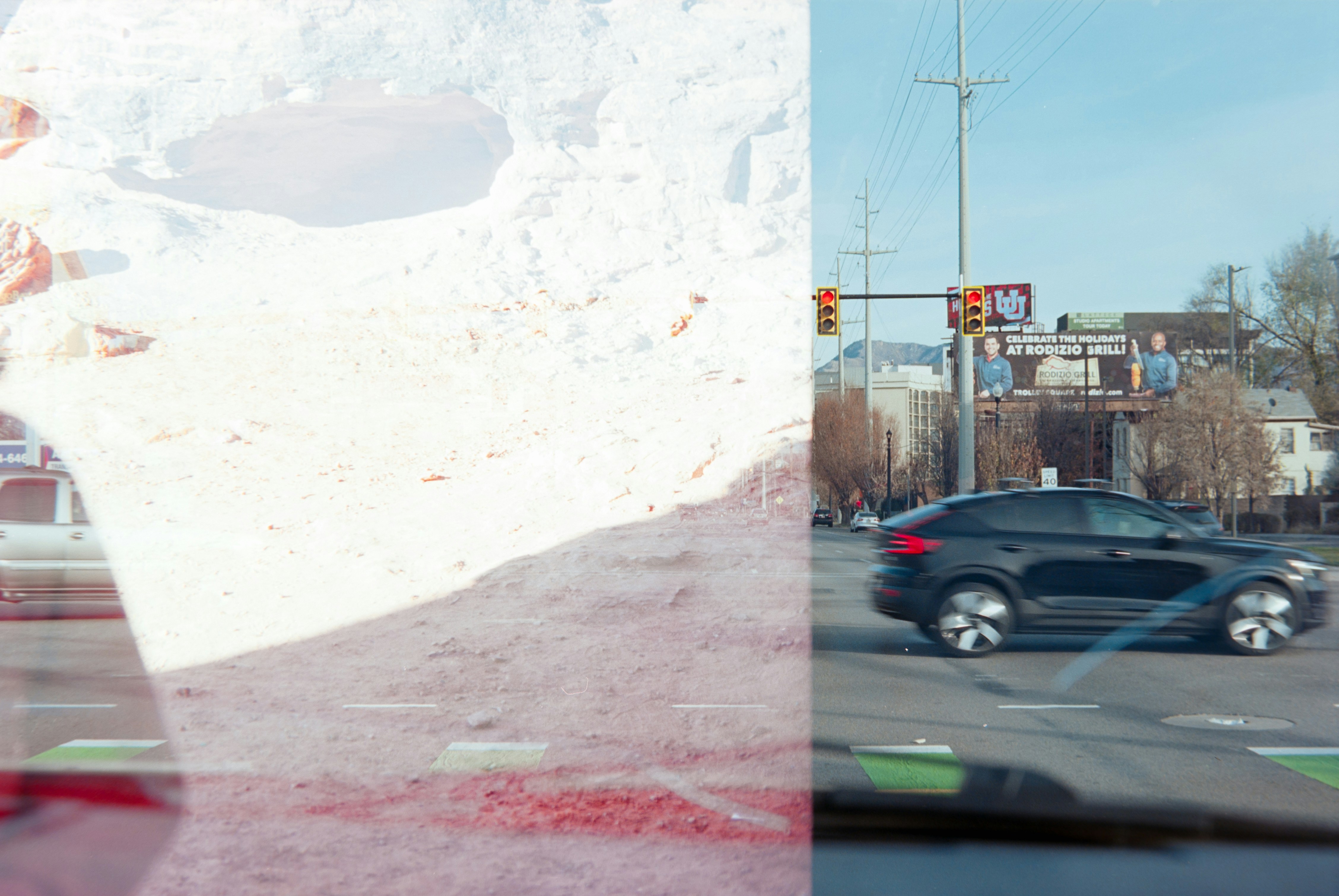 Crossroad Split: Street Scene Through a Double Exposure of Glass and Motion