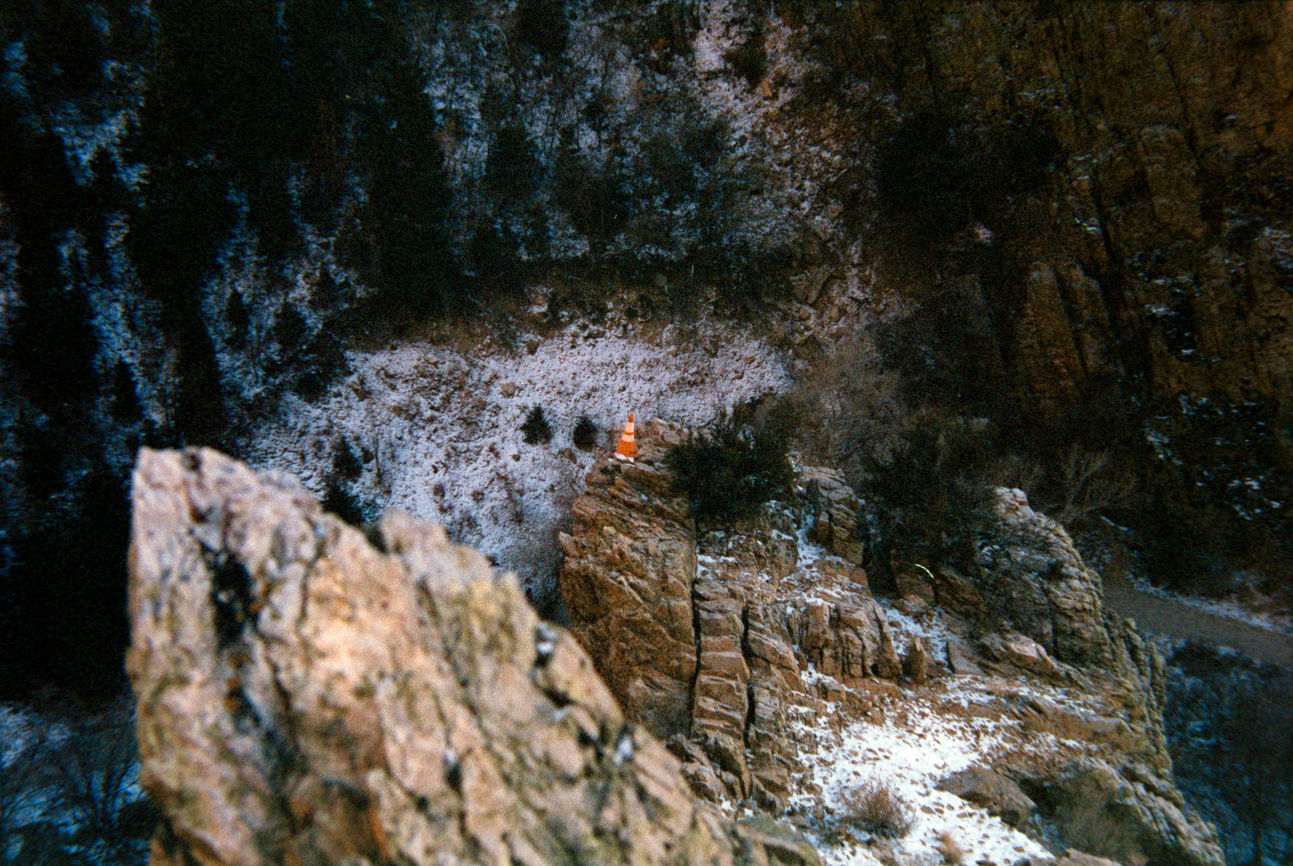 Cliff Edge Vigil on a Snow-Dusted Ridge