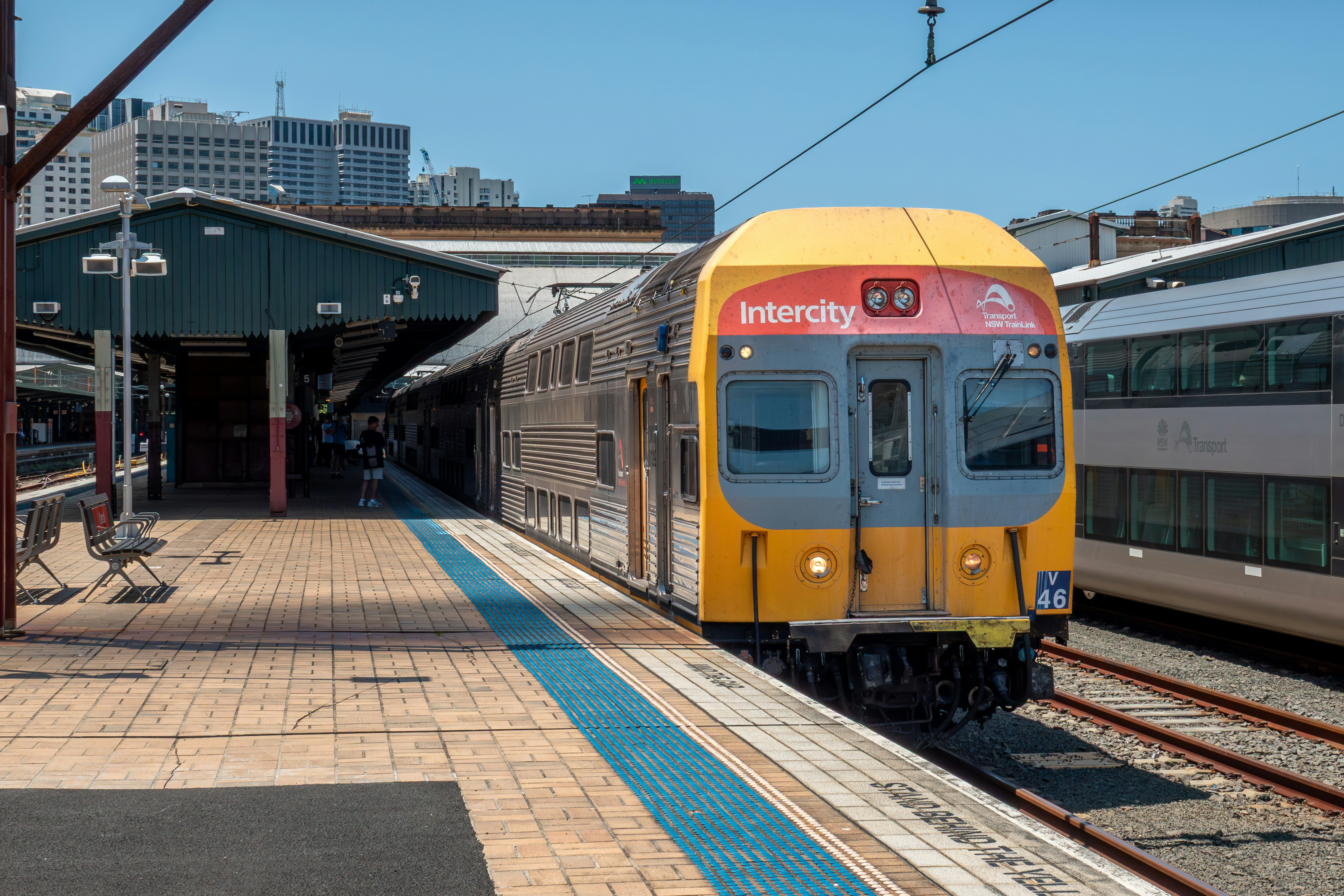 Yellow Intercity Cricket: A City Railfront with a Bright Motive