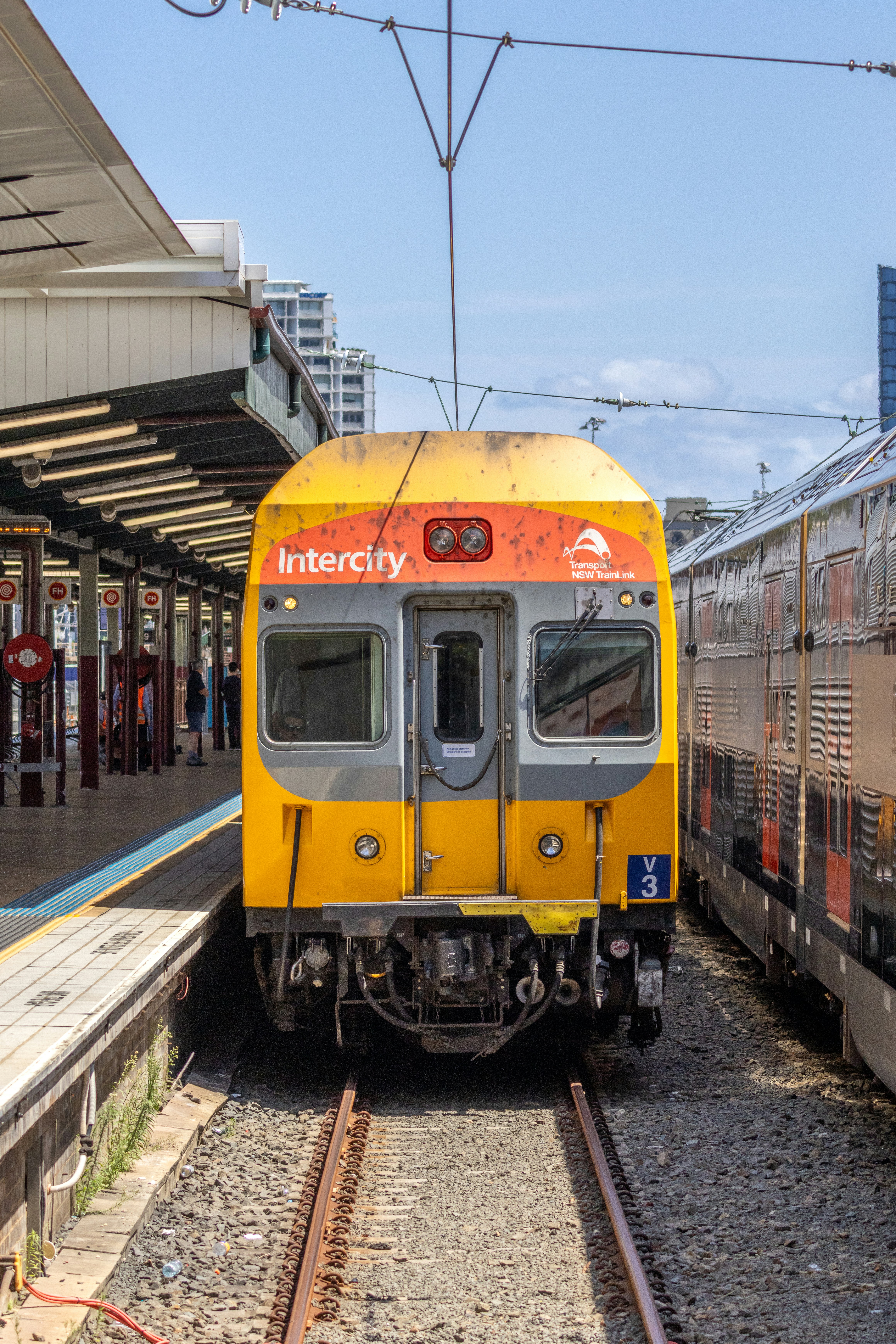 Yellow Intercity Locomotive Frontal Portrait at a Busy Platform