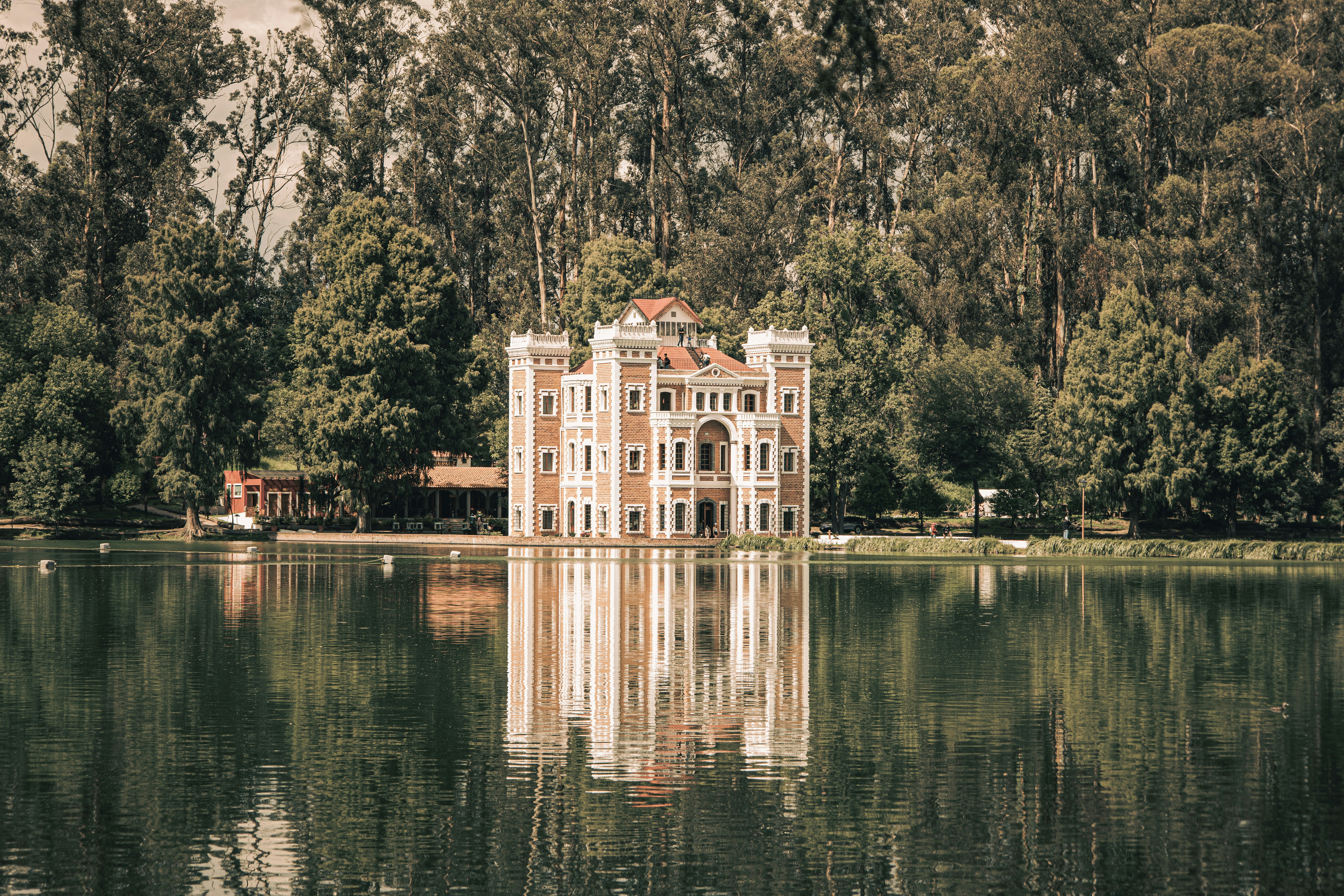 Castle in the Lake: A mirrored facade rising from tranquil water